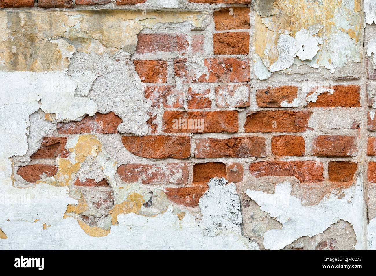 Texture of a old brick wall with traces of gray plaster Stock Photo - Alamy