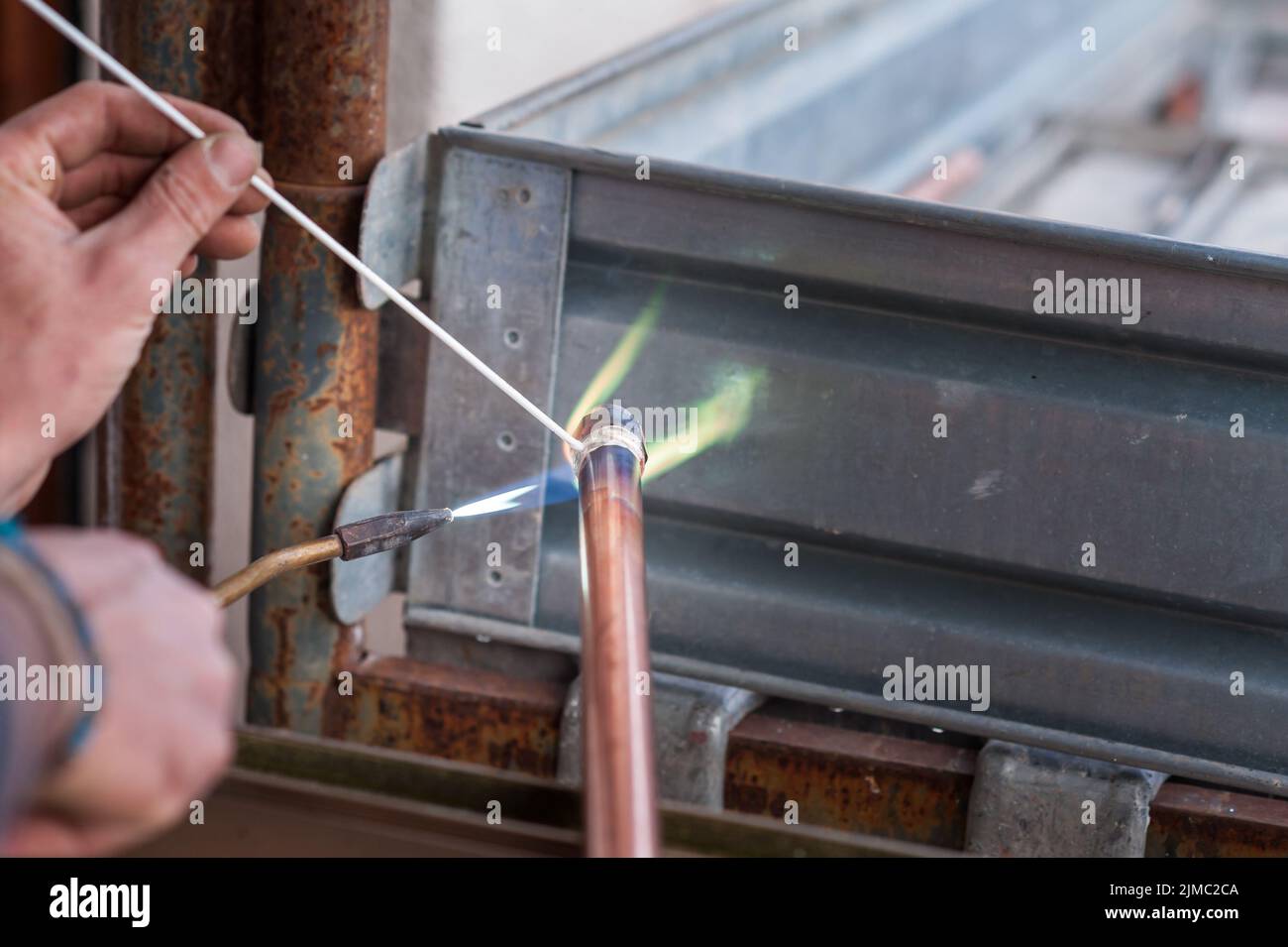 Welding of copper pipe Stock Photo - Alamy
