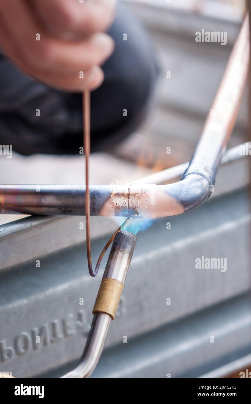 Welding of copper pipe Stock Photo - Alamy