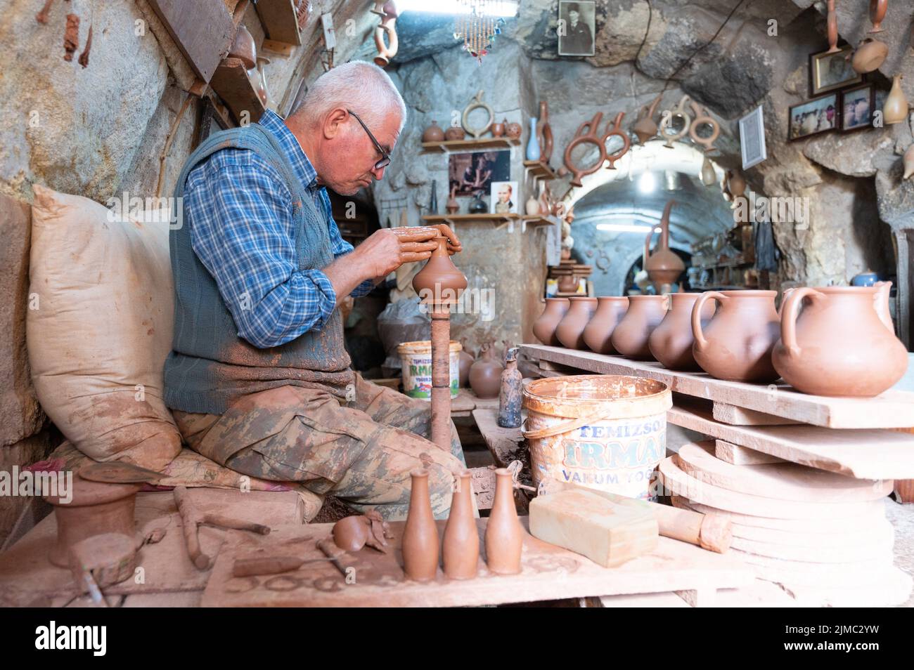 Avanos, Turkey. 29th June, 2022. Potter Mehmet Körükcü sits at a potter ...