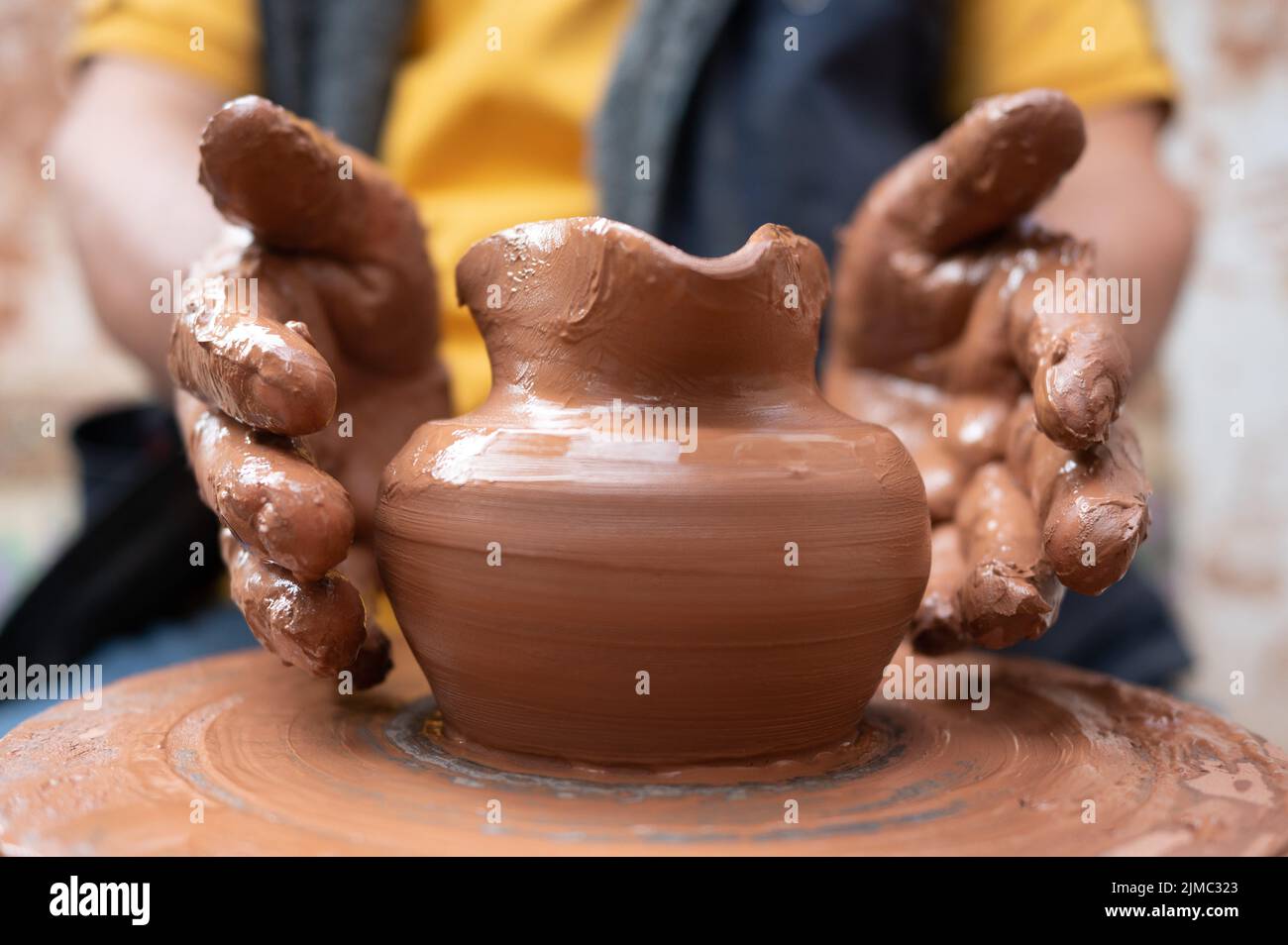 Avanos, Turkey. 27th June, 2022. A potter with a chapka sits in front ...