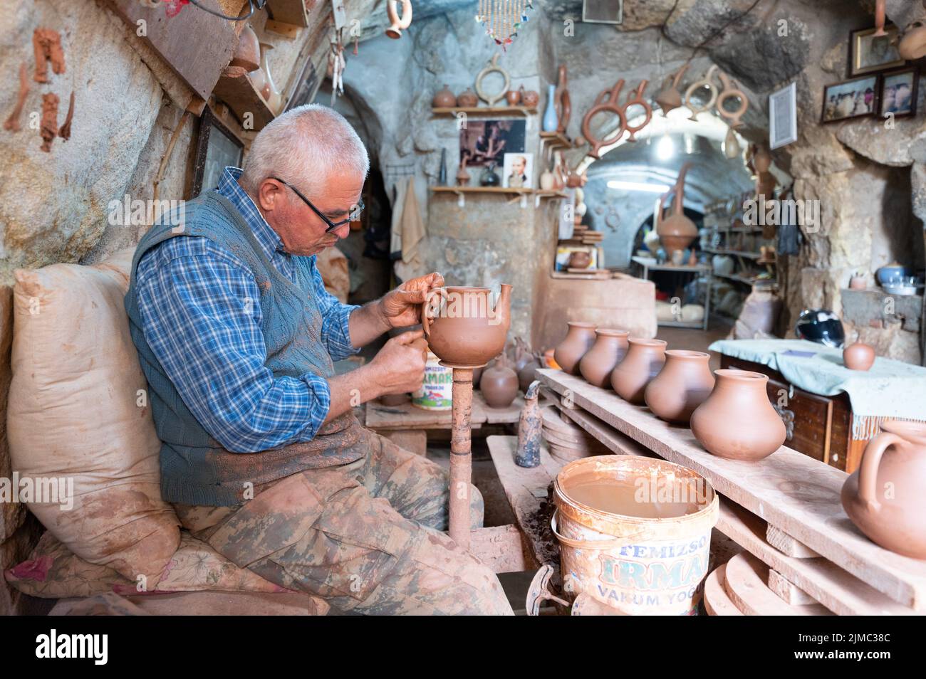 Avanos, Turkey. 29th June, 2022. Potter Mehmet Körükcü sits at a potter ...