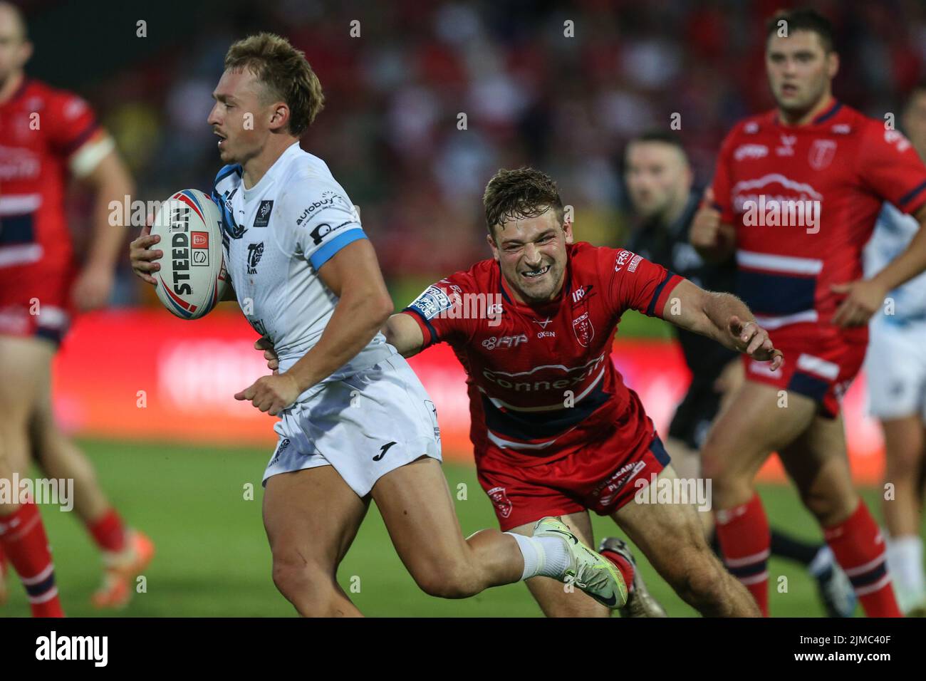 Jimmy Keinhorst #18 of Hull KR tackles Olly Ashall-Bott #27 of Toulouse ...