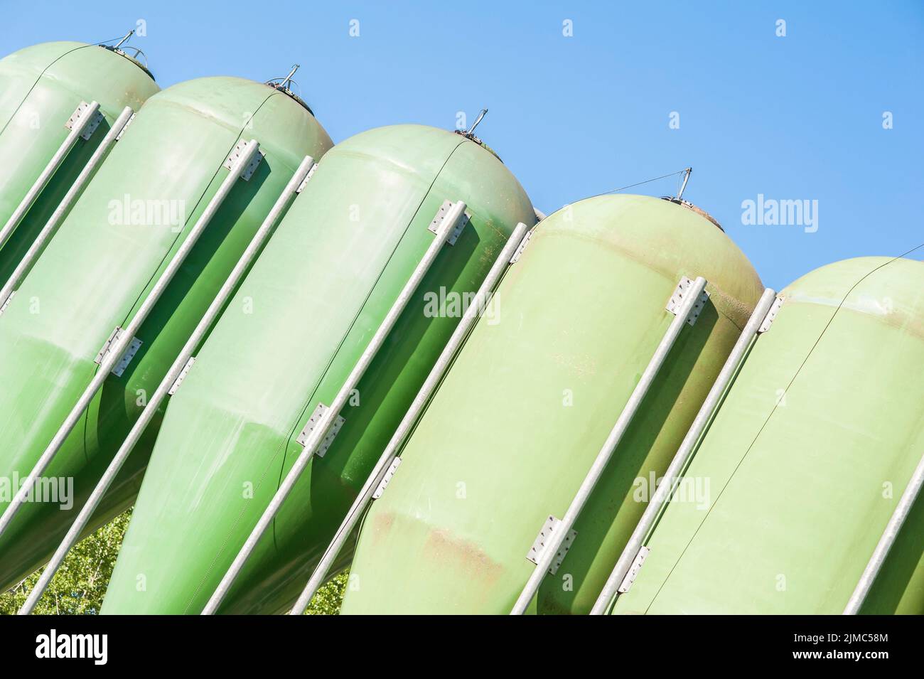 Agricultural green silos Stock Photo - Alamy