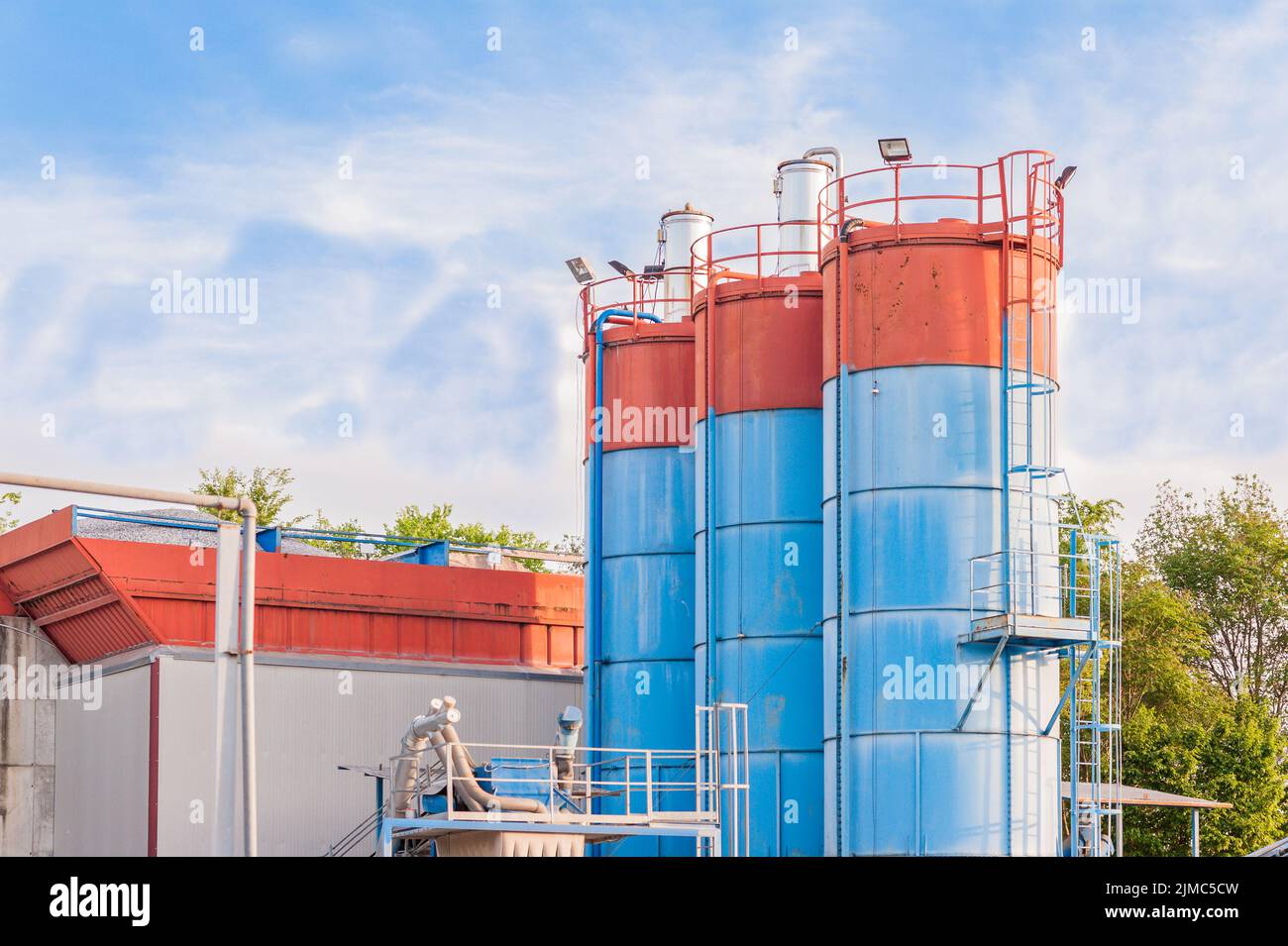 Silos for the production of cement Stock Photo - Alamy