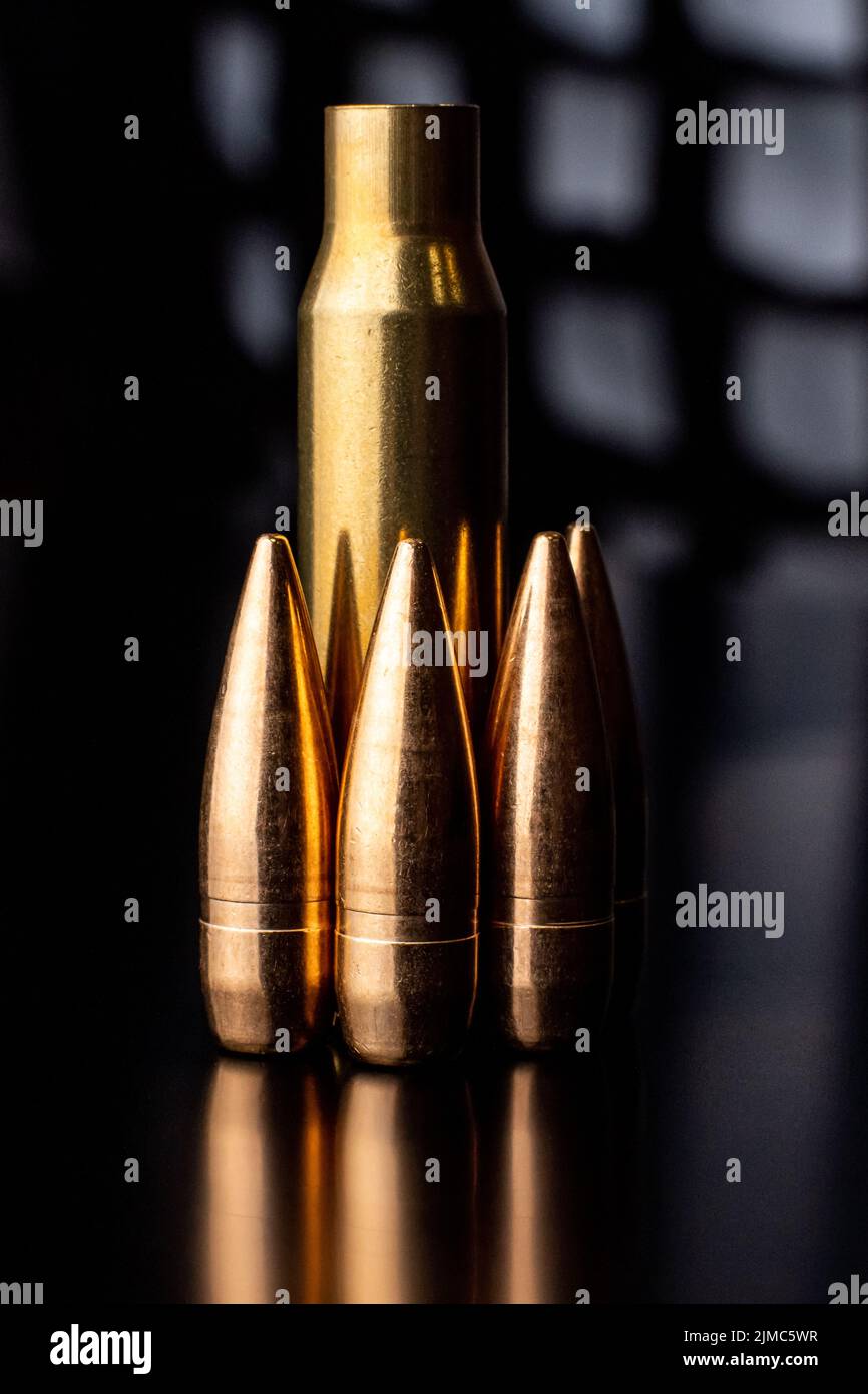 Bullet on black background with reflexion. Rifle bullets close-up on ...
