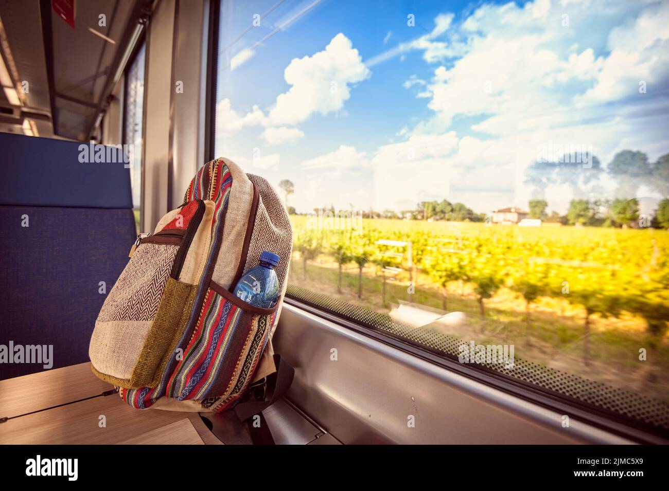 Backpack on the train near the window. Travel conceptual image Stock ...