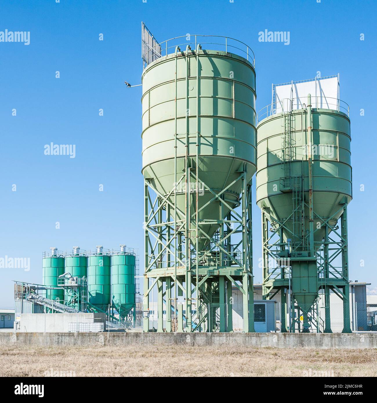 Two silos for lime Stock Photo - Alamy