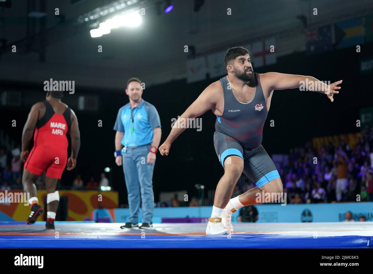 England's Mandhir Kooner celebrates after winning his Men's Freestyle ...