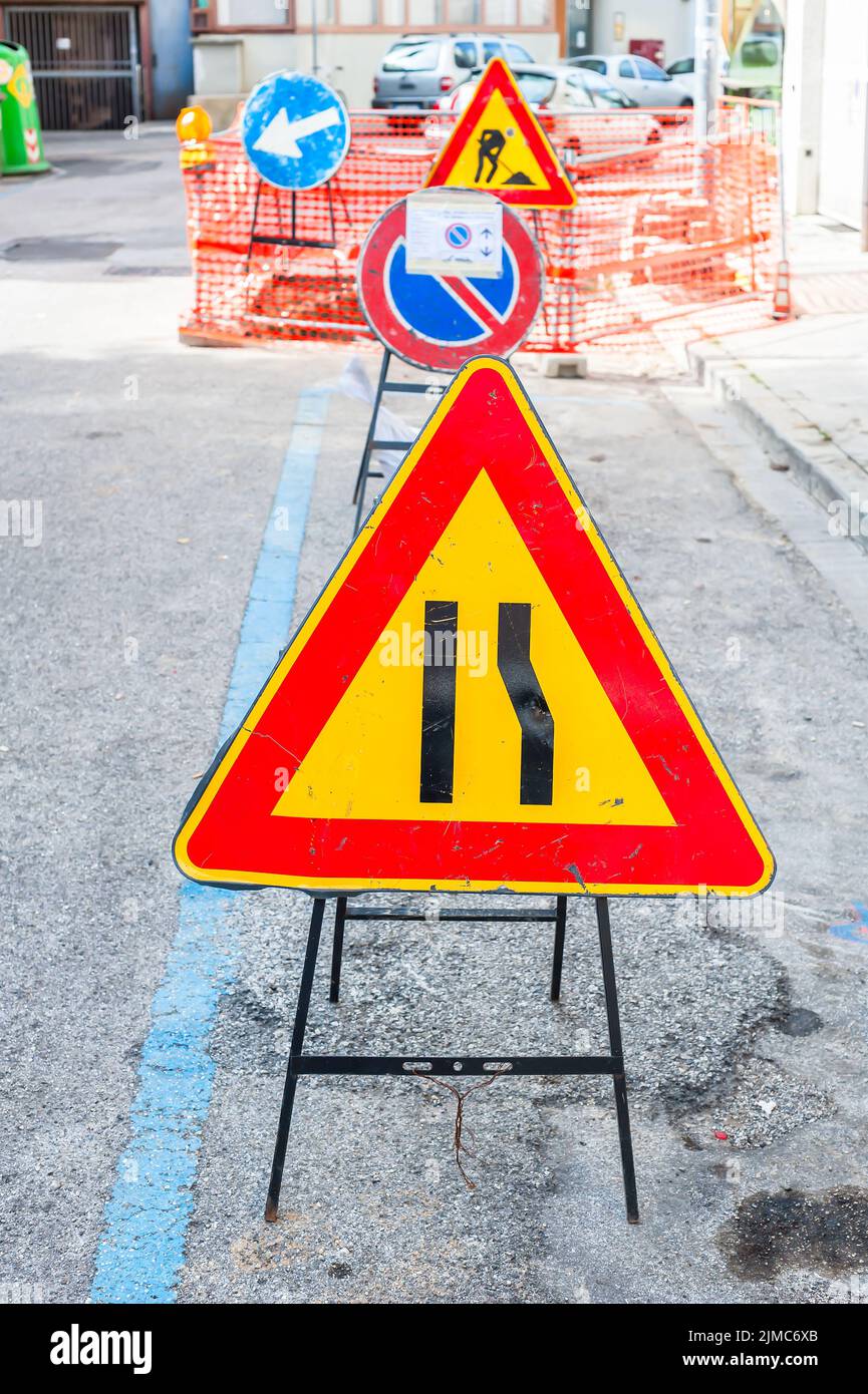 Road sign lane narrowing Stock Photo - Alamy