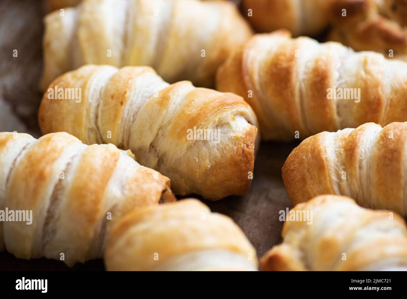 Pigs in a blanket - puff pastry baking with sausages Stock Photo - Alamy