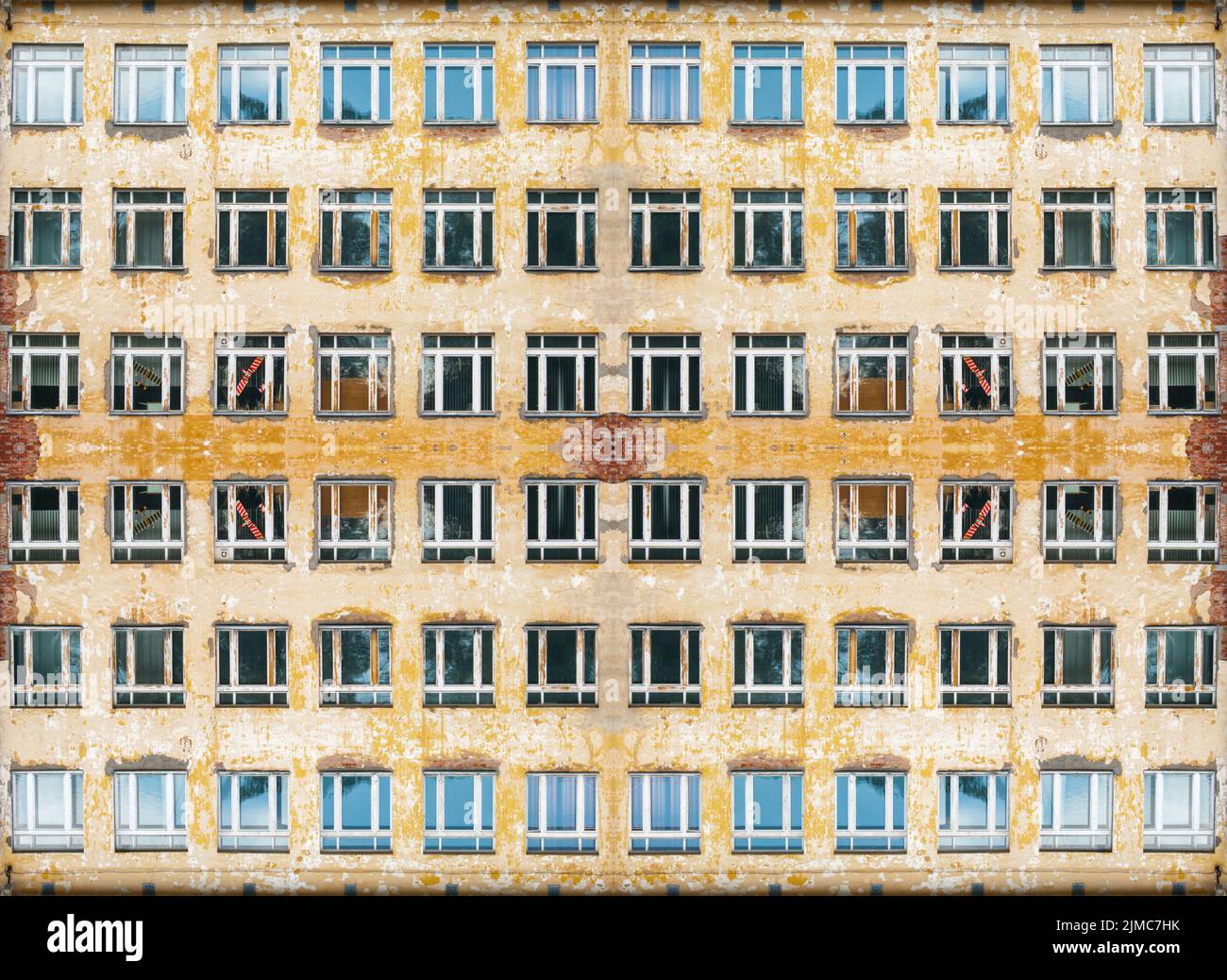 The windows on the old yellow wall with collapsed plaster - an infinite ...