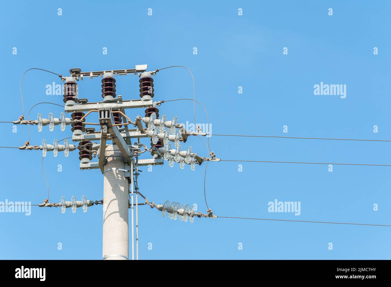 Power pole with external electric separator on top Stock Photo - Alamy