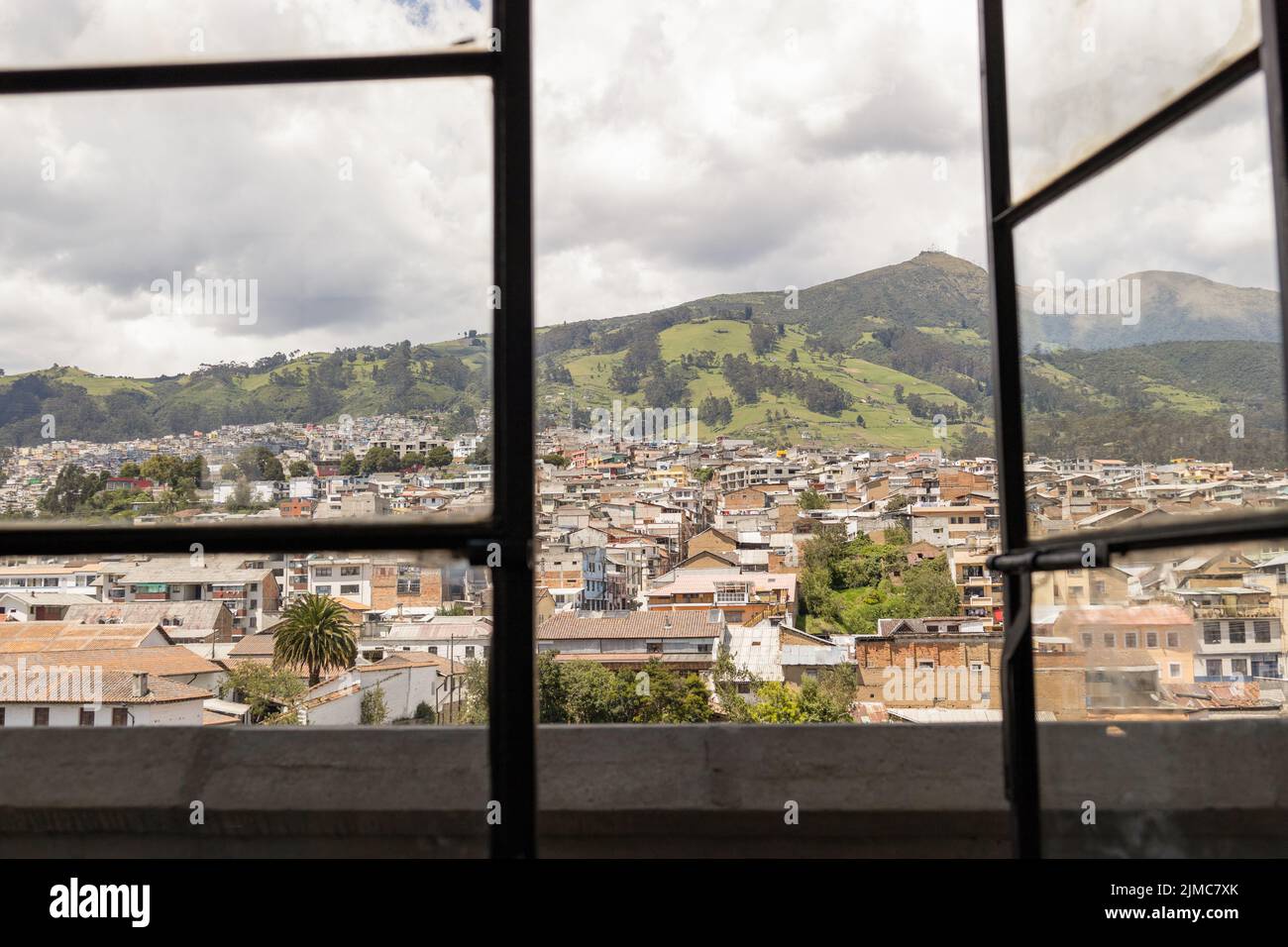 through a window the landscape of the city of Quito-Ecuador in Latin ...