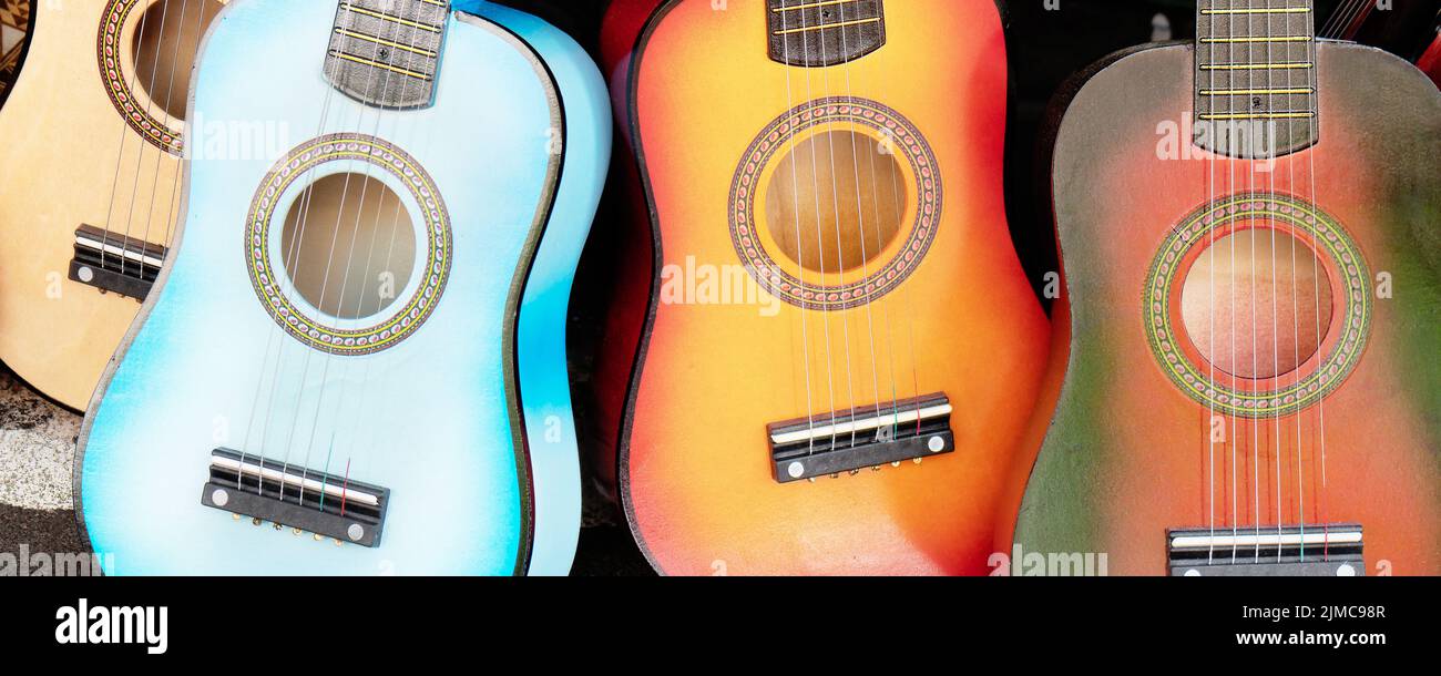 Ukulele guitars background hi-res stock photography and images - Alamy