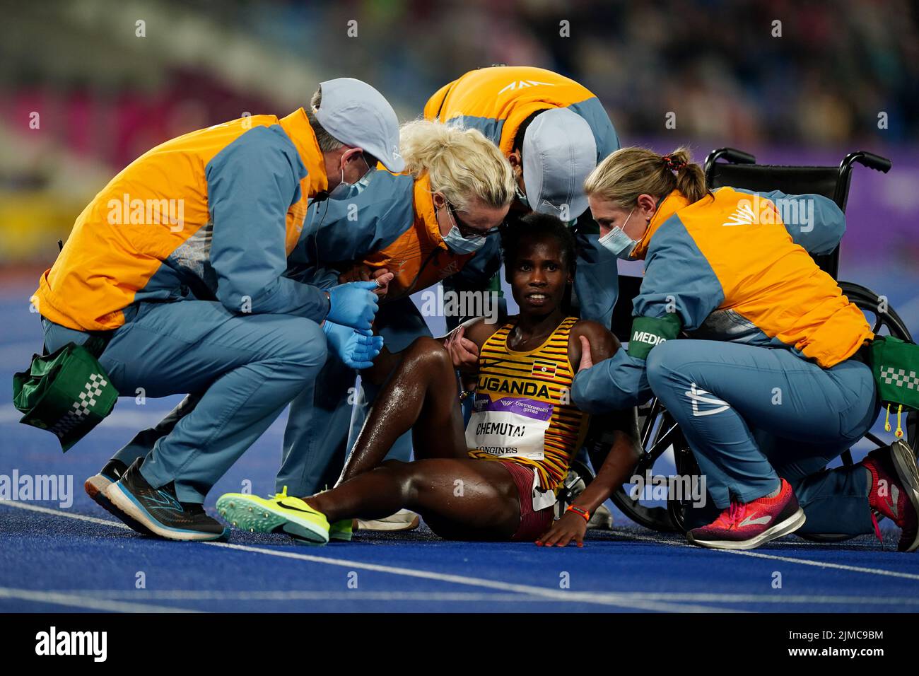 Uganda’s Peruth Chemutai receives medical attention after the Women’s ...