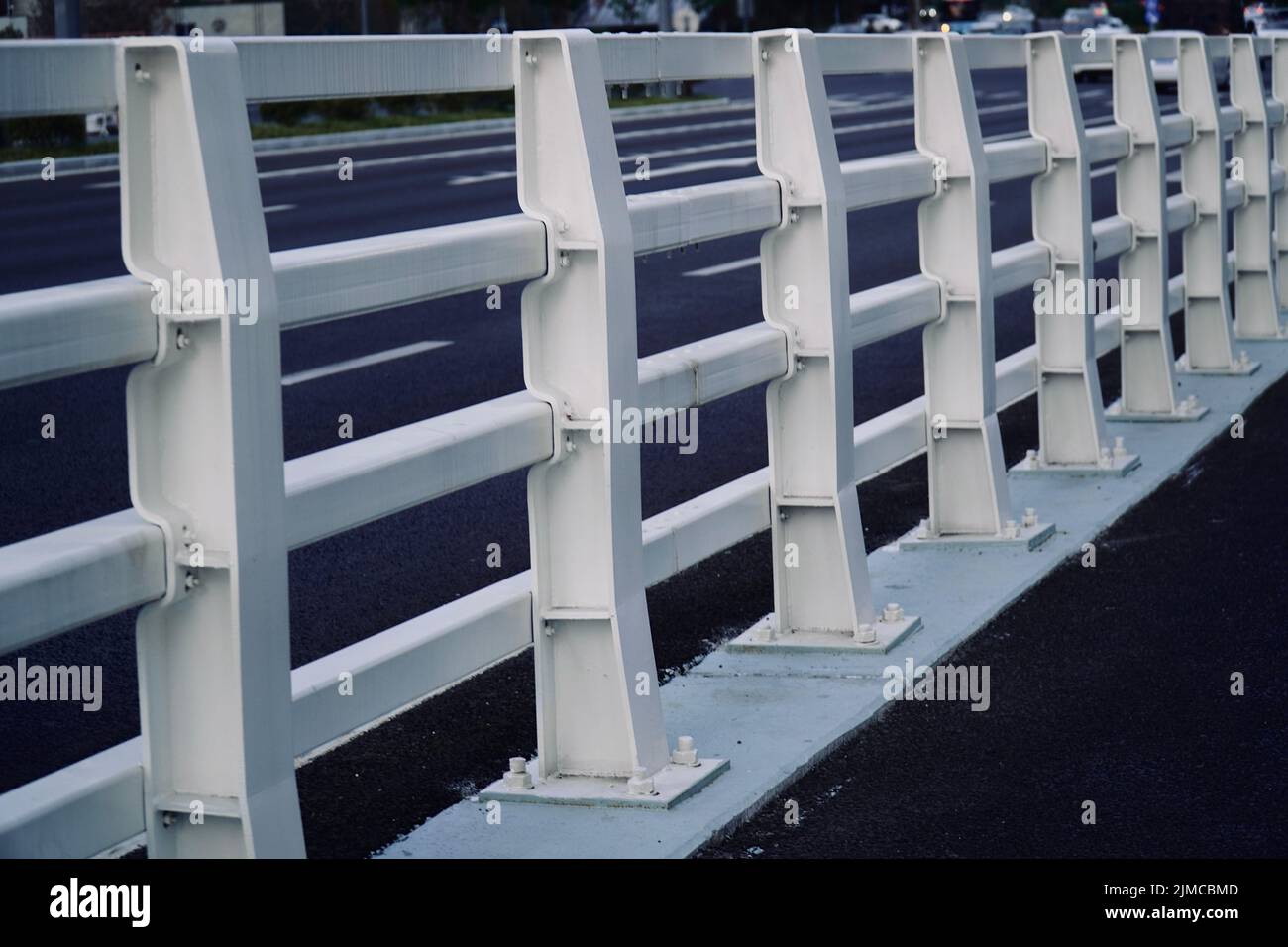 A closeup of white steel railings by the road in China Stock Photo - Alamy