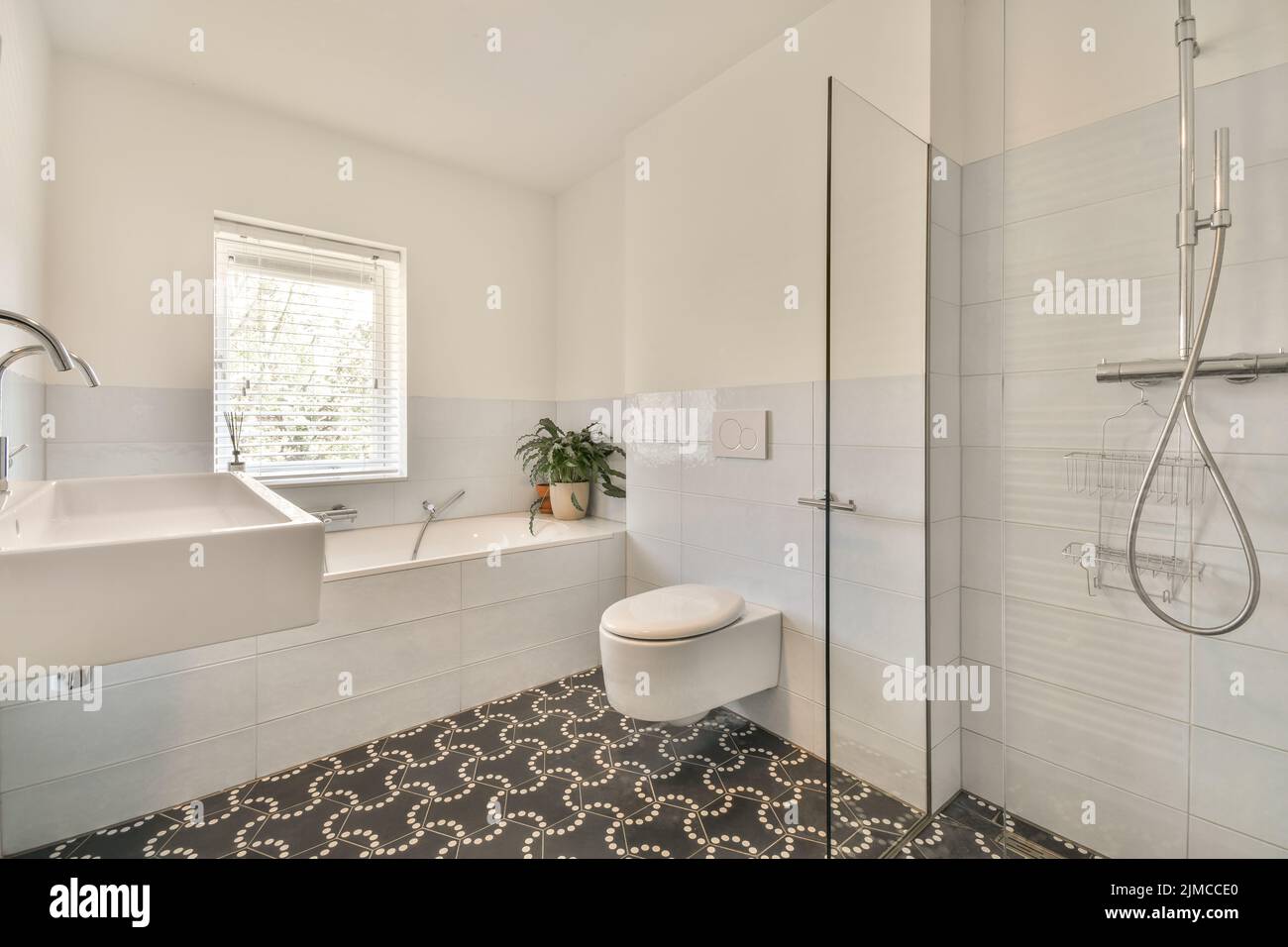 Modern home interior design of white bathroom with open bathtub and ...