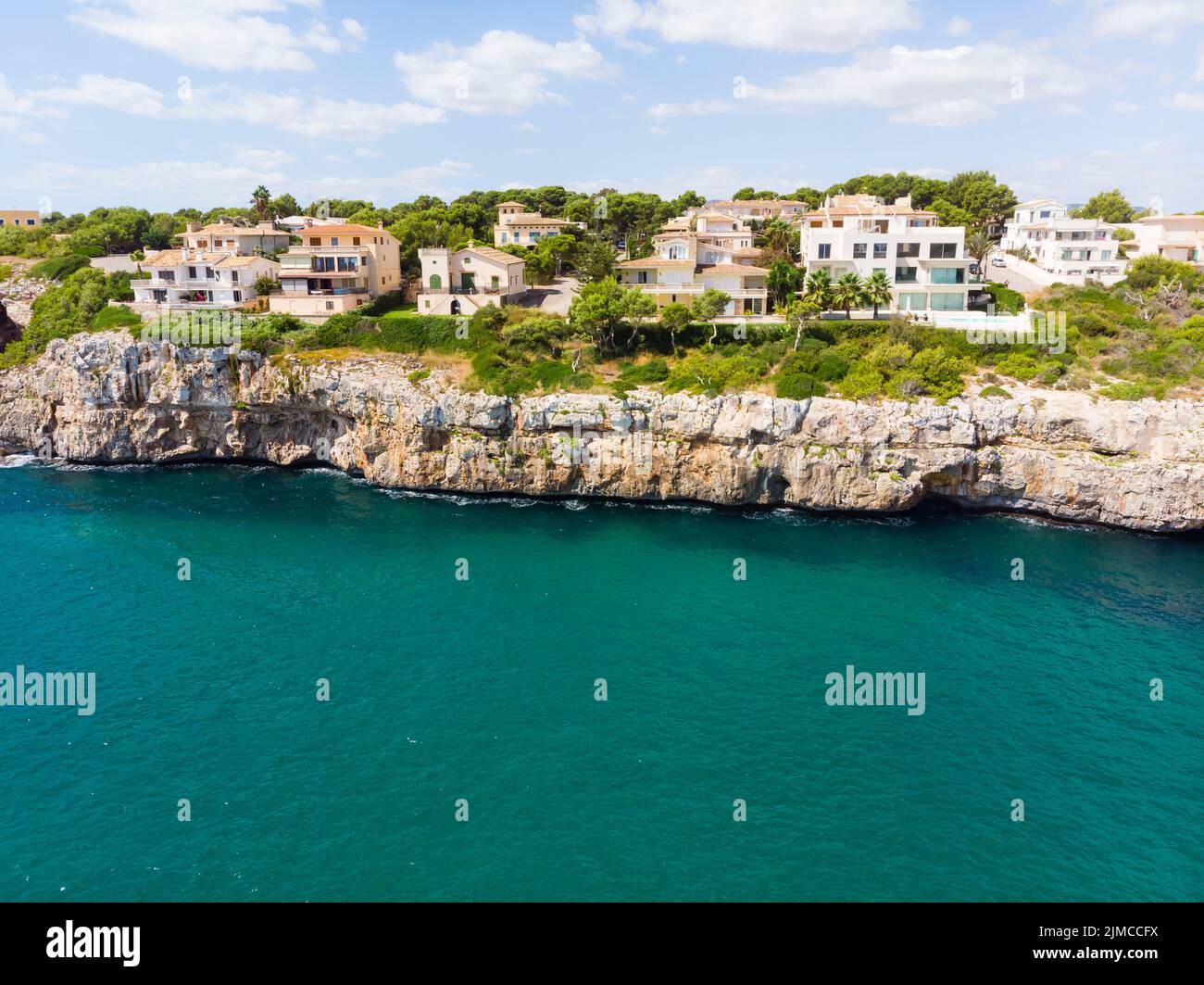Aerial view, Porto Cristo, coast with villas and natural harbor ...