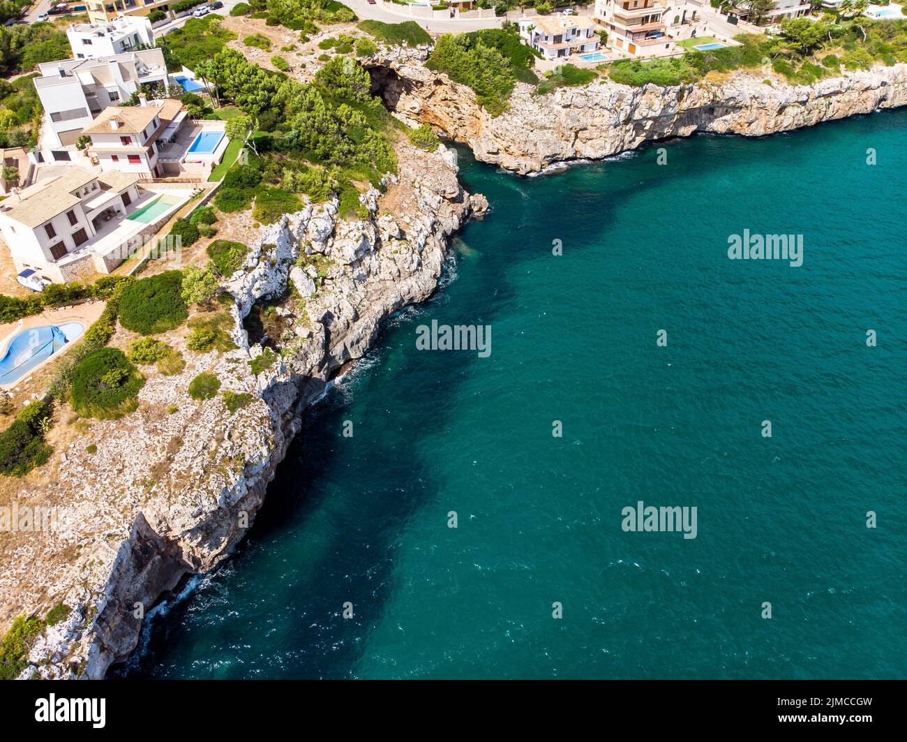Aerial view, Porto Cristo, coast with villas and natural harbor ...