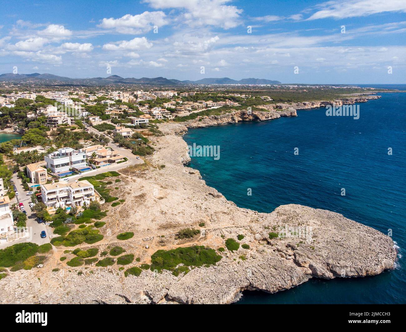 Aerial view, Porto Cristo, coast with villas and natural harbor ...