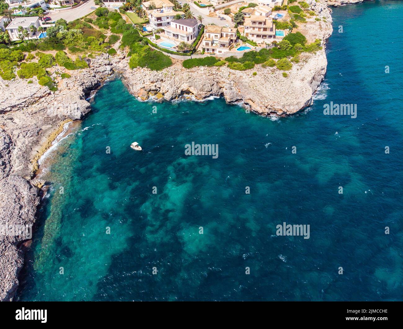 Aerial view, Porto Cristo, coast with villas and natural harbor ...