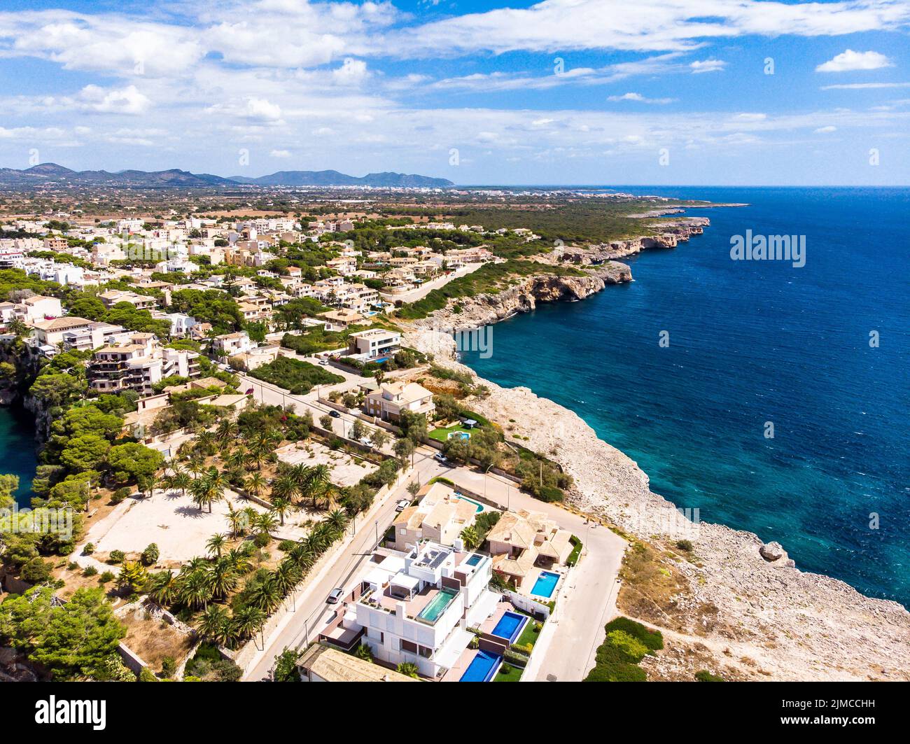Aerial view, Porto Cristo, coast with villas and natural harbor ...