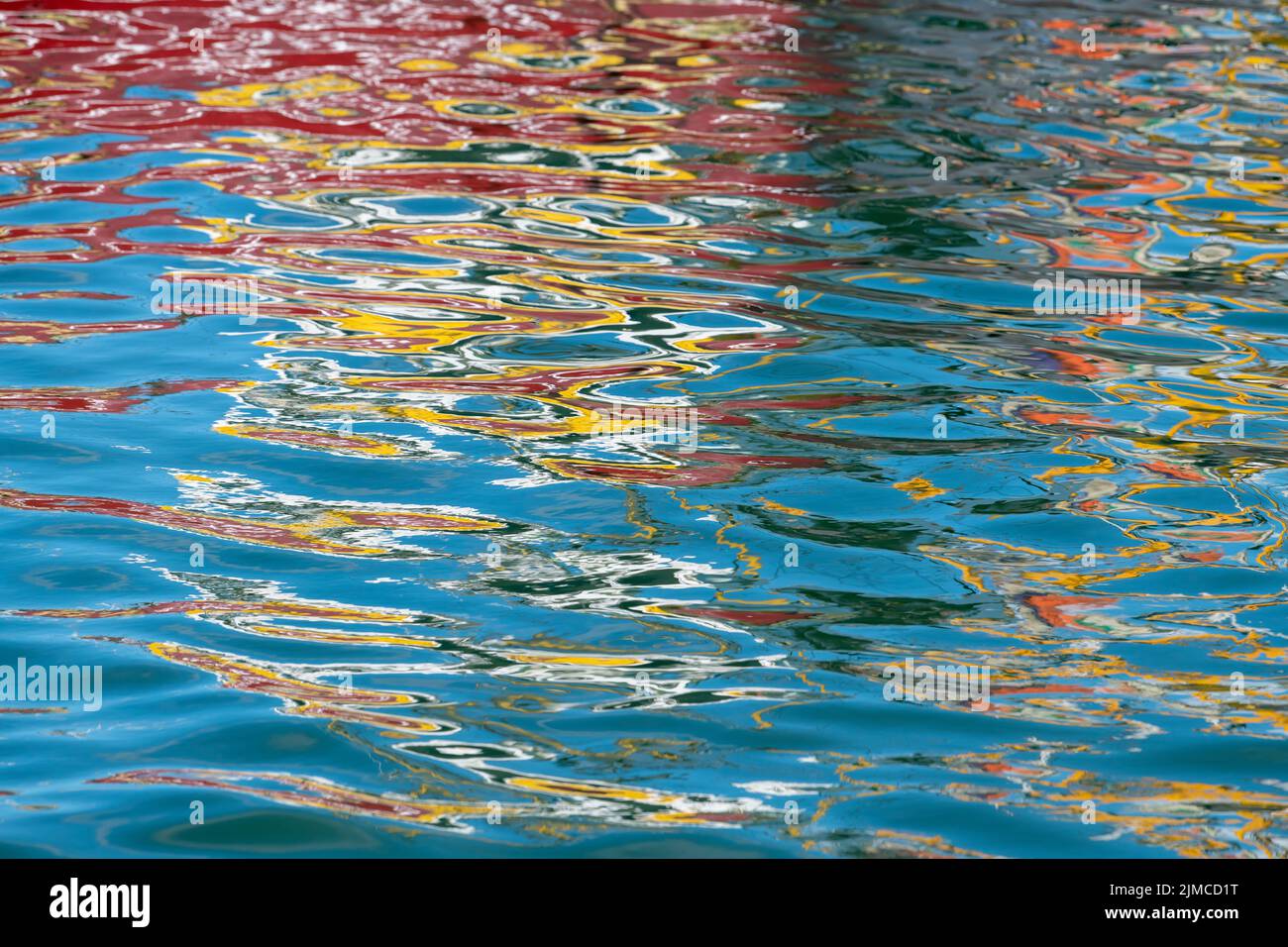Colorful reflection of a boat in the water Stock Photo - Alamy