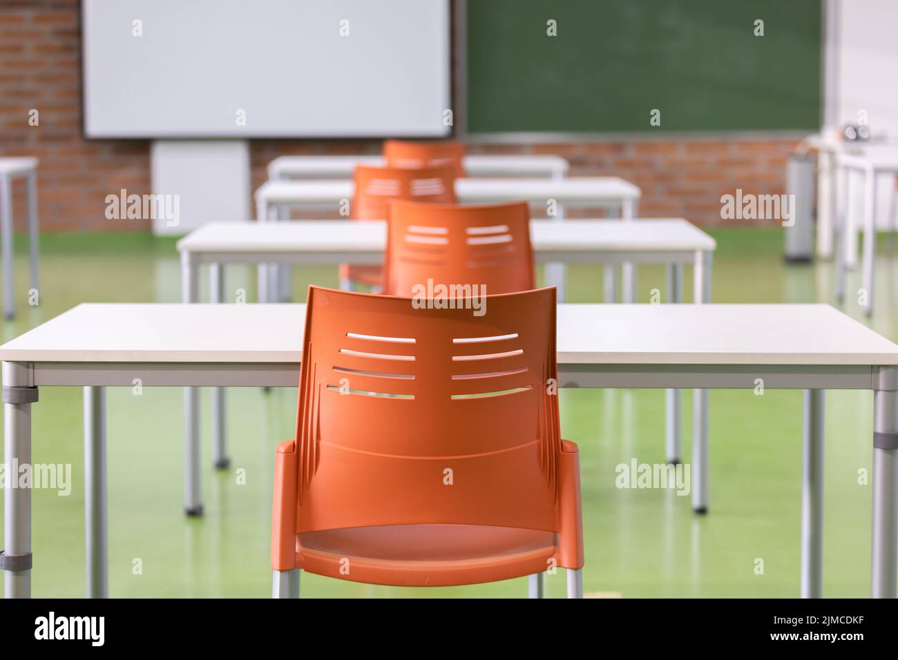 decoration of the interior of a classroom in a school with desks ...