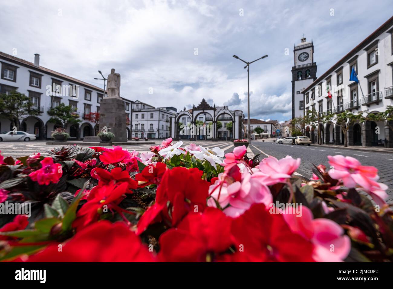 Red and Pink Flowers with "Portas da Cidade", the city symbol of Ponta ...