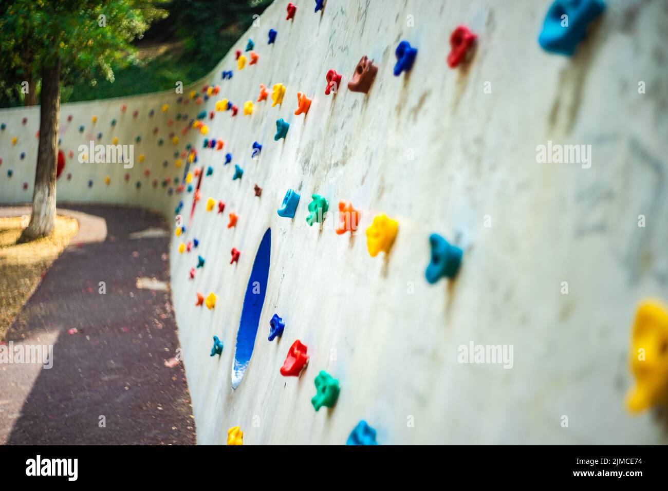 Summer kids activity playground with climbing wall Stock Photo - Alamy