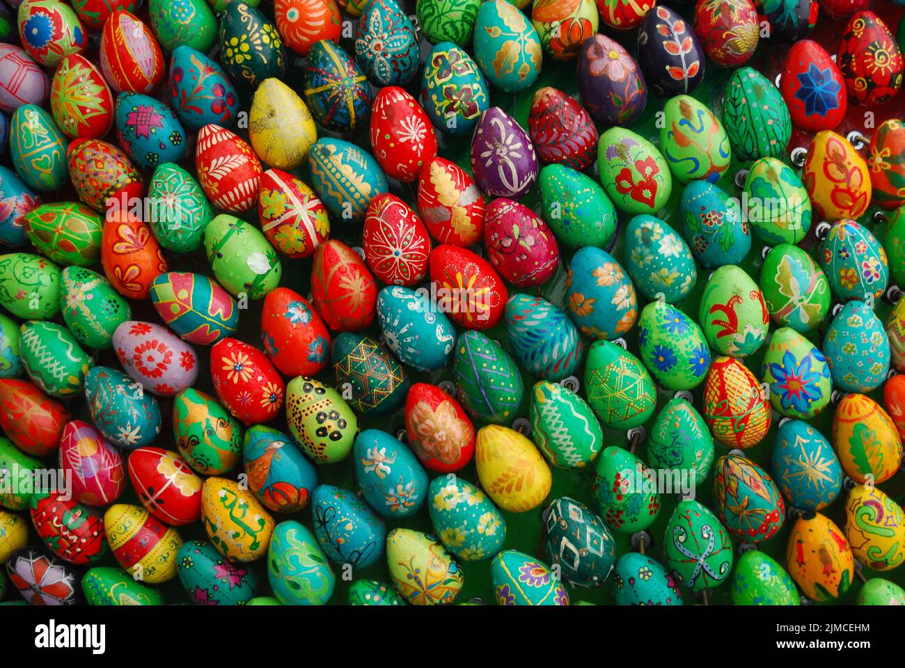 Easter background of colored eggs in green tones, traditional ...