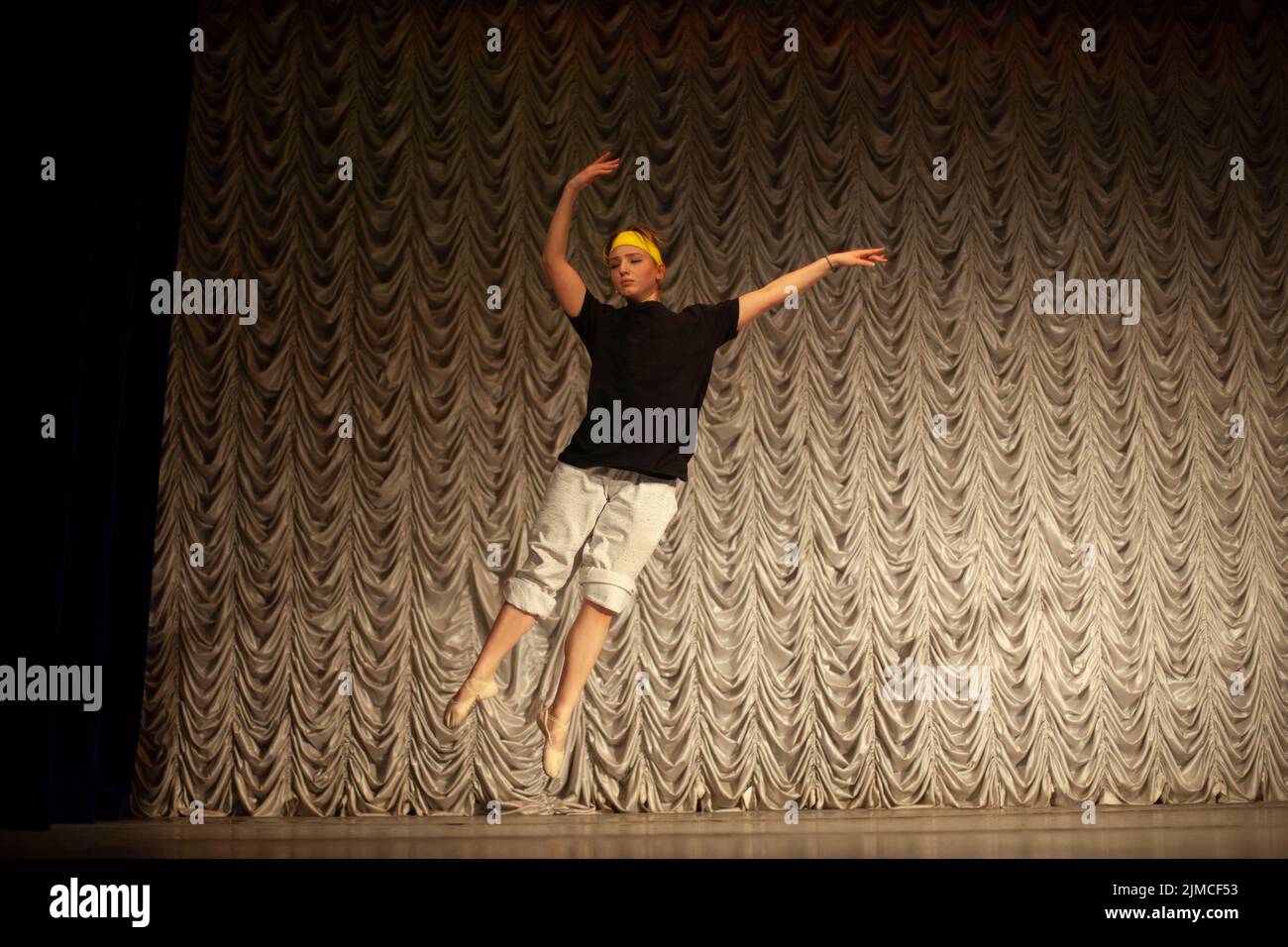 Ballerina jumps. Jump in dance. Dance teacher shows movement. Dance ...