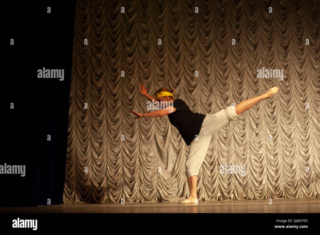 Ballerina jumps. Jump in dance. Dance teacher shows movement. Dance ...