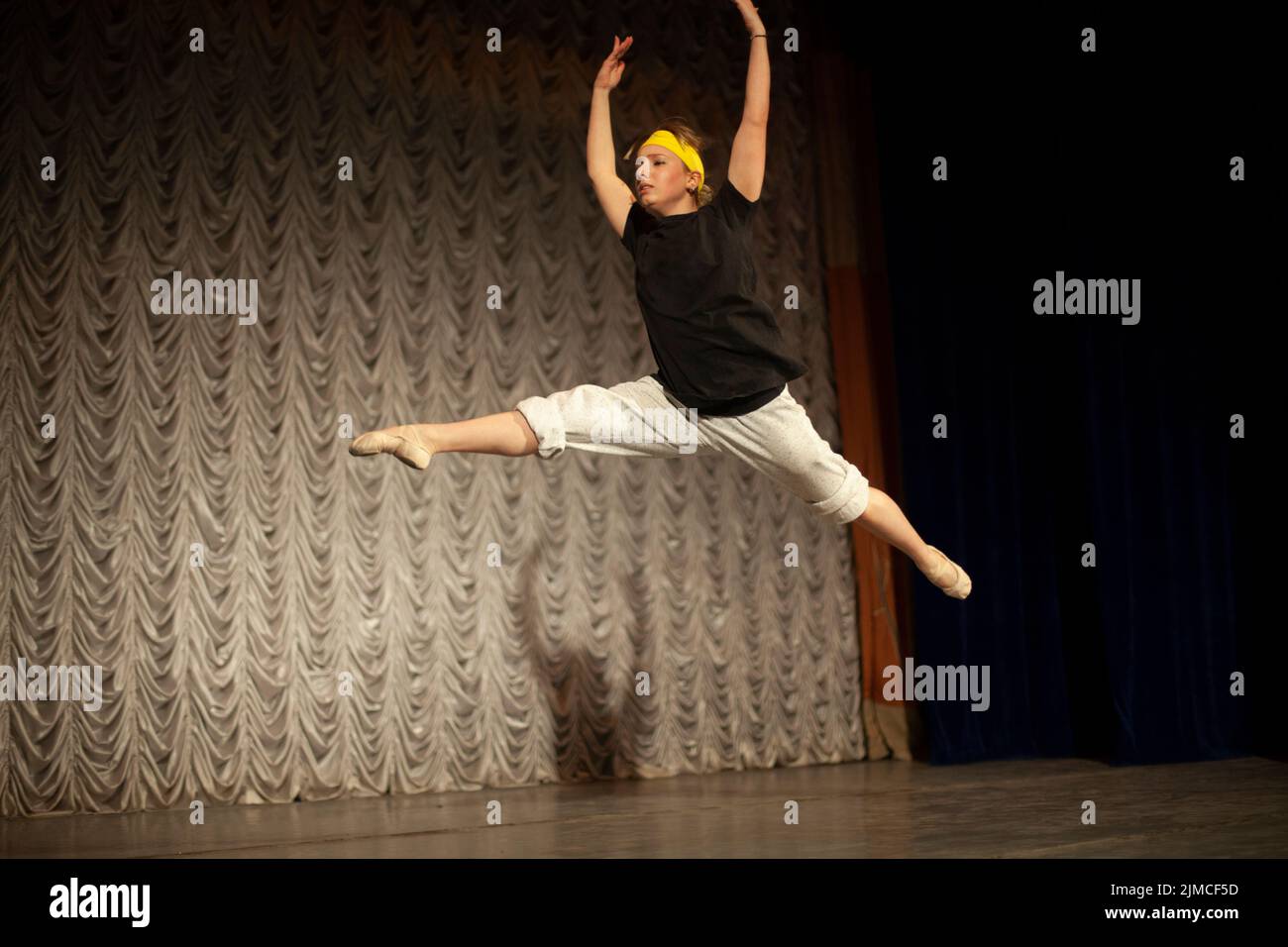 Ballerina jumps. Jump in dance. Dance teacher shows movement. Dance ...