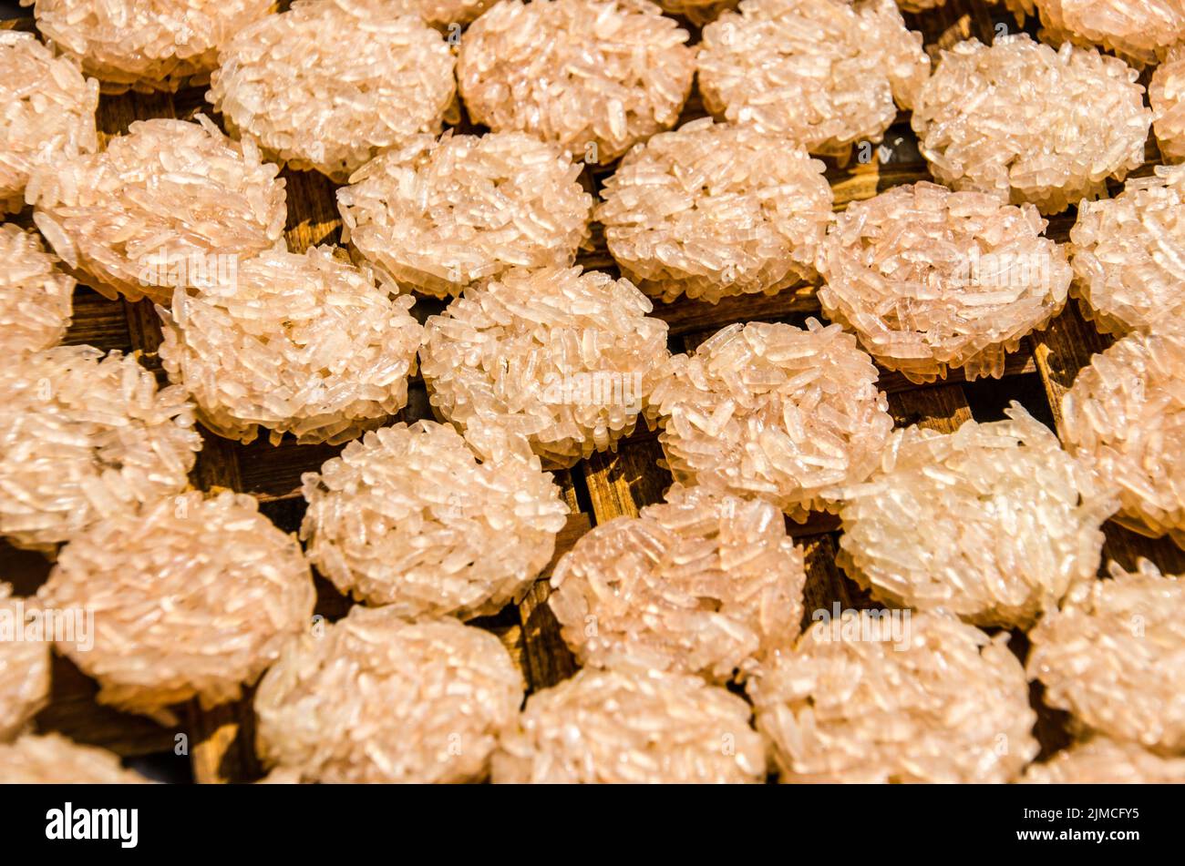 Thai Rice cakes drying in the sun Stock Photo - Alamy