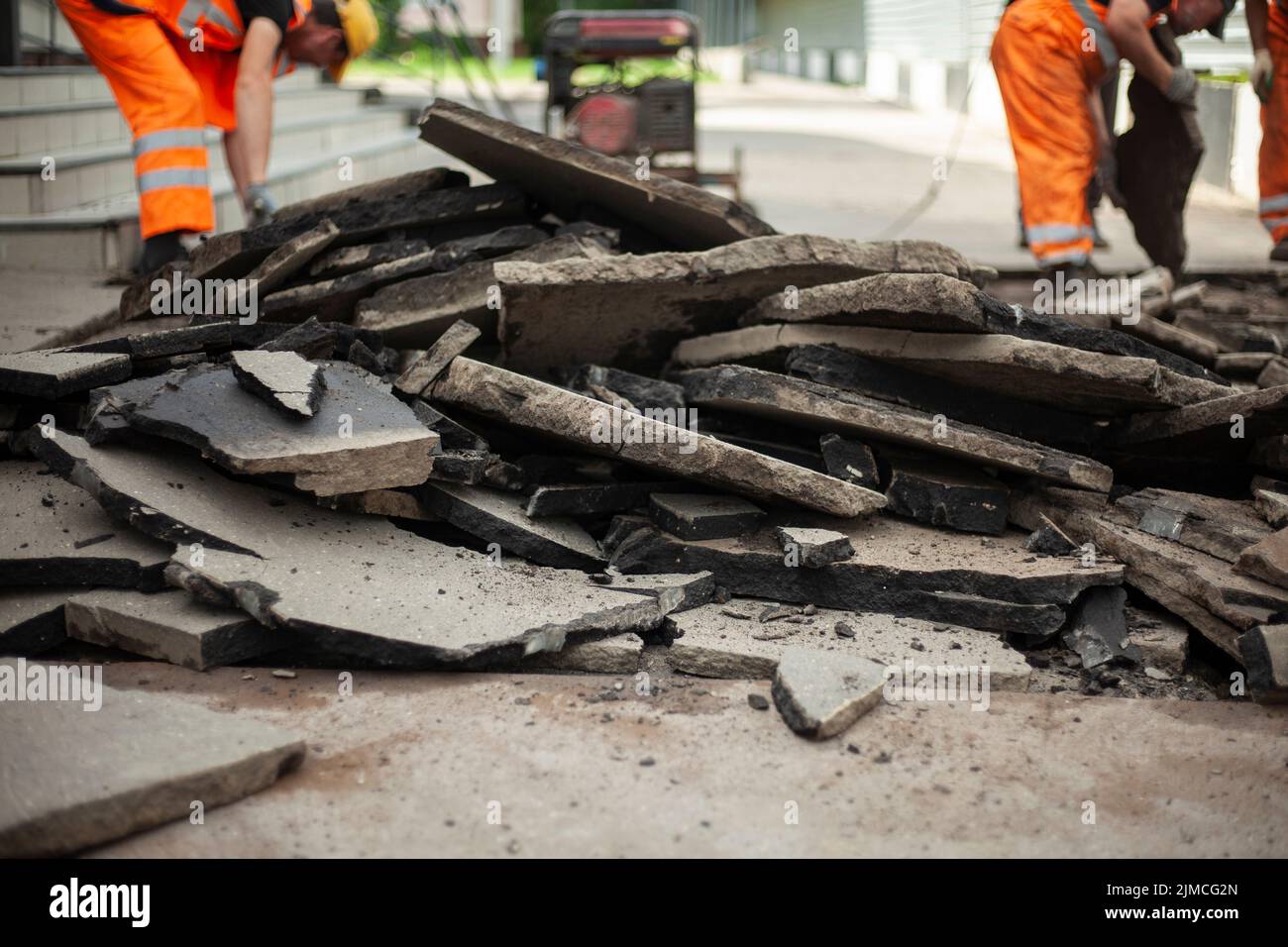 Road repair. Installation of curbs on the highway. The workers are ...