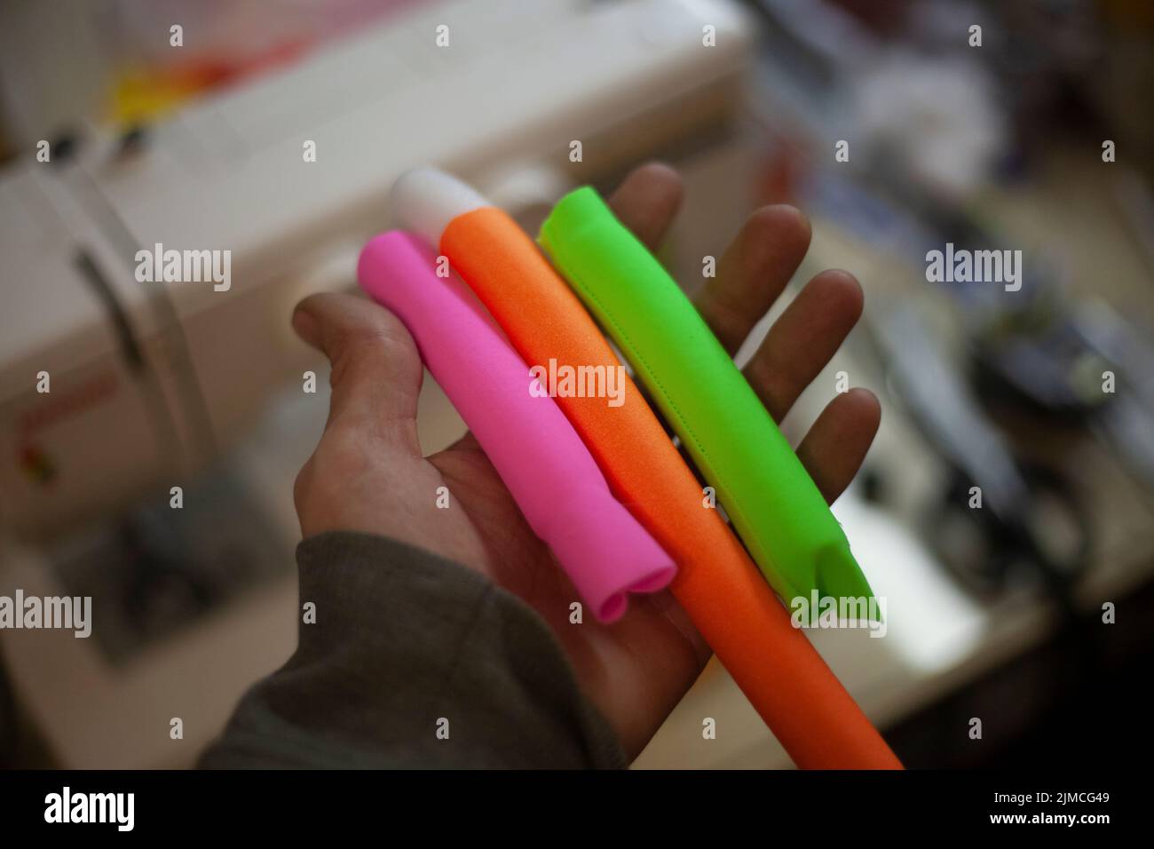 Neon-colored foam tubes. Needlework at home. Items for sewing in the ...