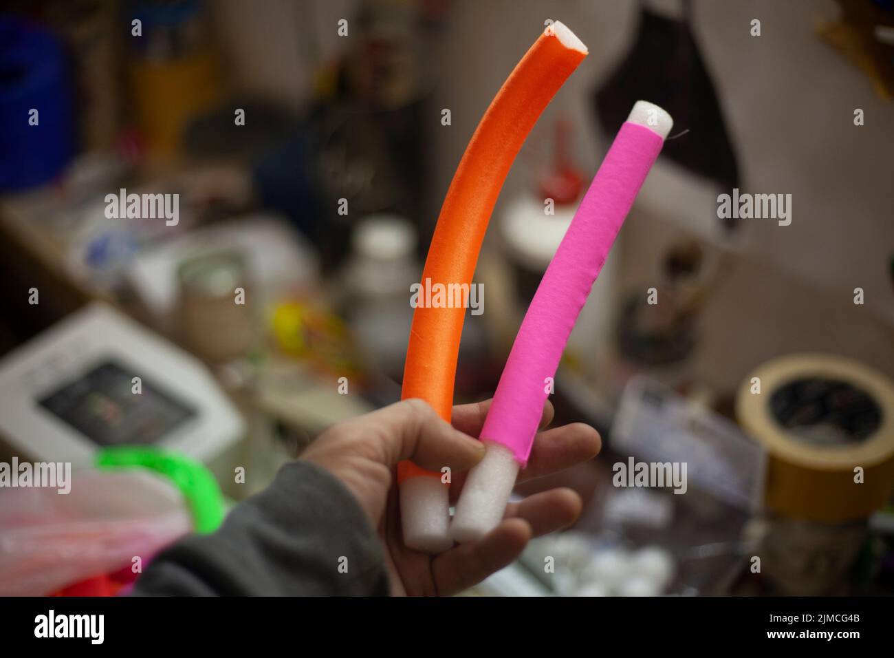 Neon-colored foam tubes. Needlework at home. Items for sewing in the ...