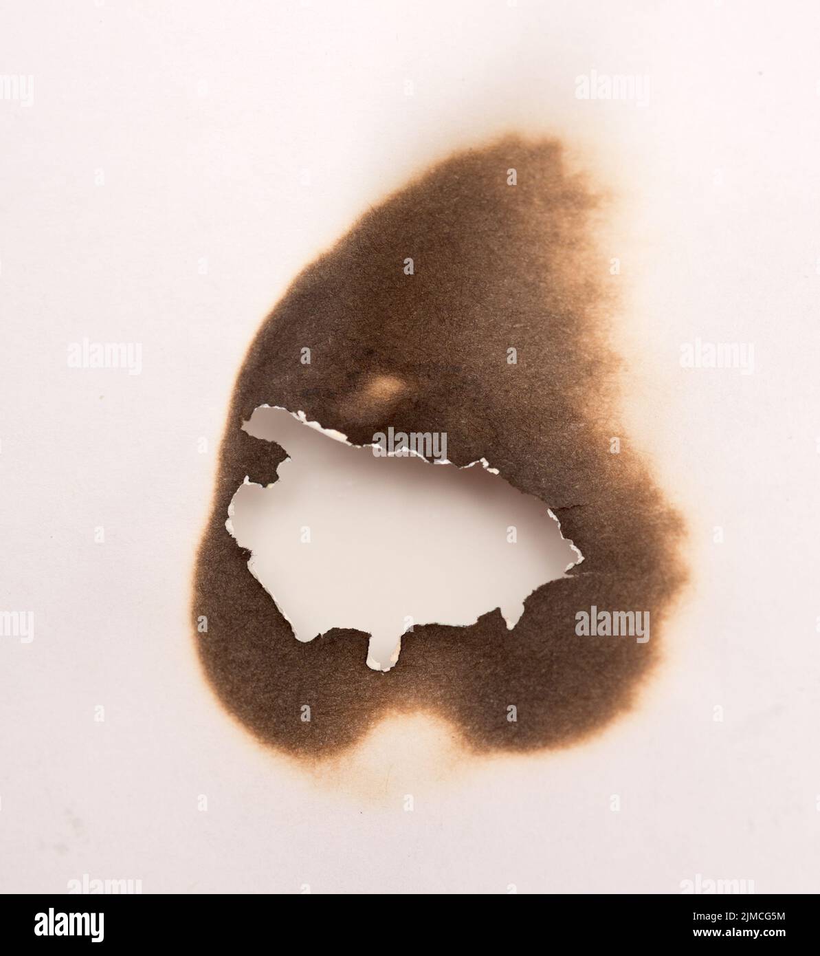 Burn hole hi-res stock photography and images - Alamy