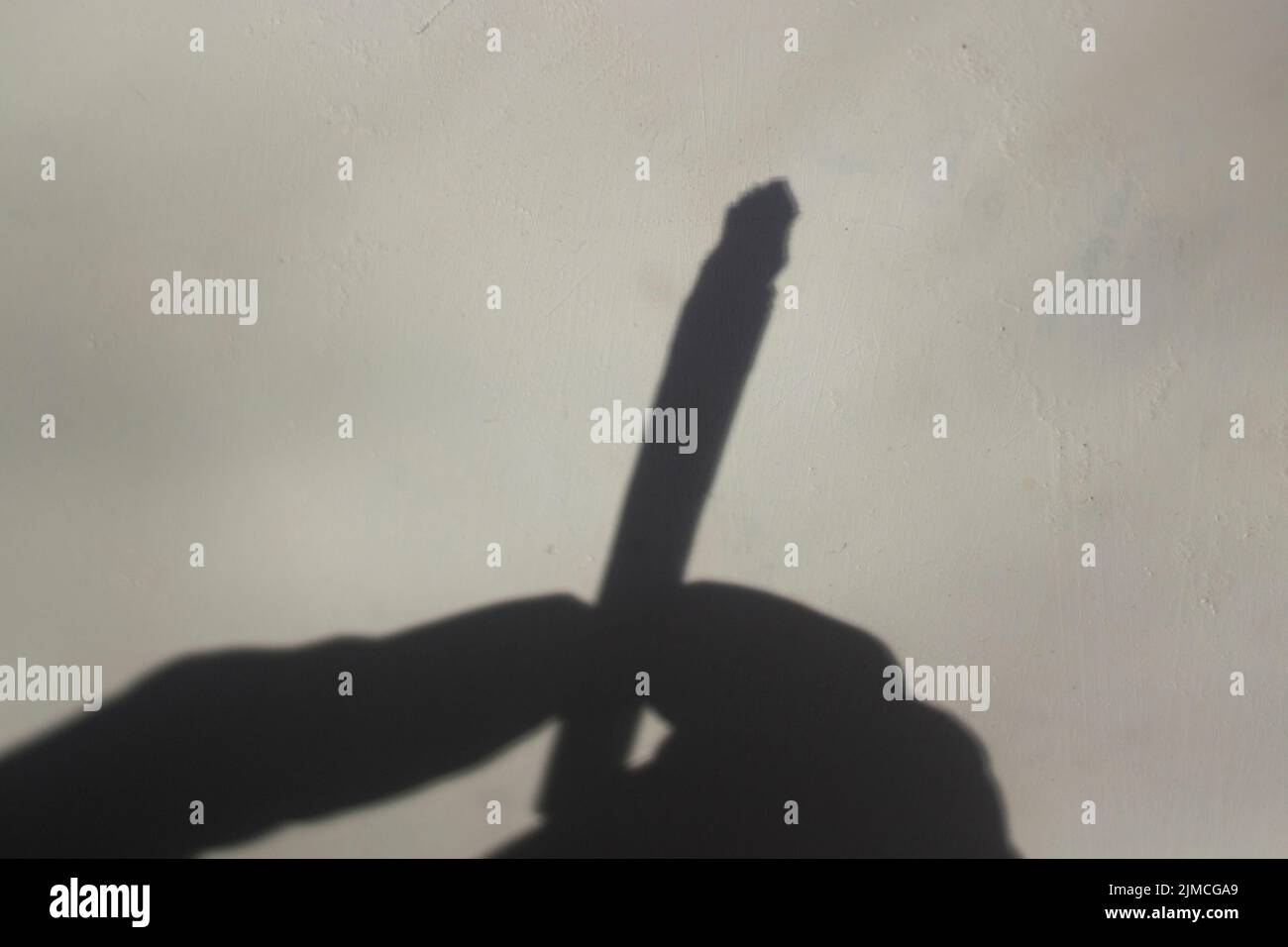 Silhouette man smoking cigarette in hi-res stock photography and images ...