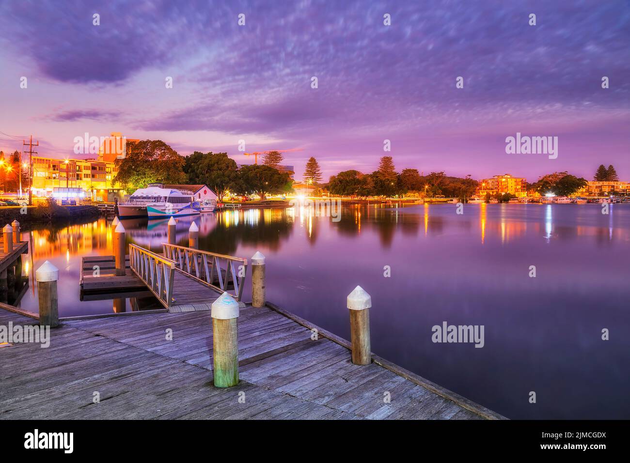 Wooden boardwalk along Coolongolook river Wallis lake in Forster town ...