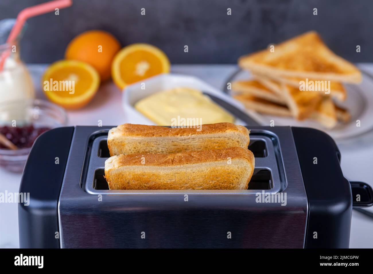Slices of toast coming out of the toaster for healthy breakfast Stock ...