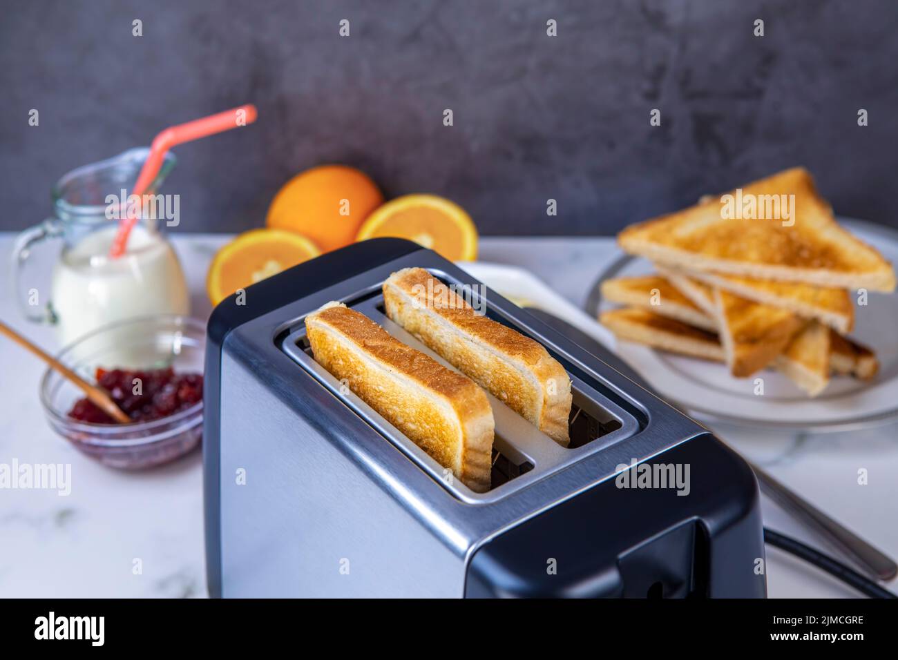 Slices of toast coming out of the toaster for healthy breakfast Stock ...