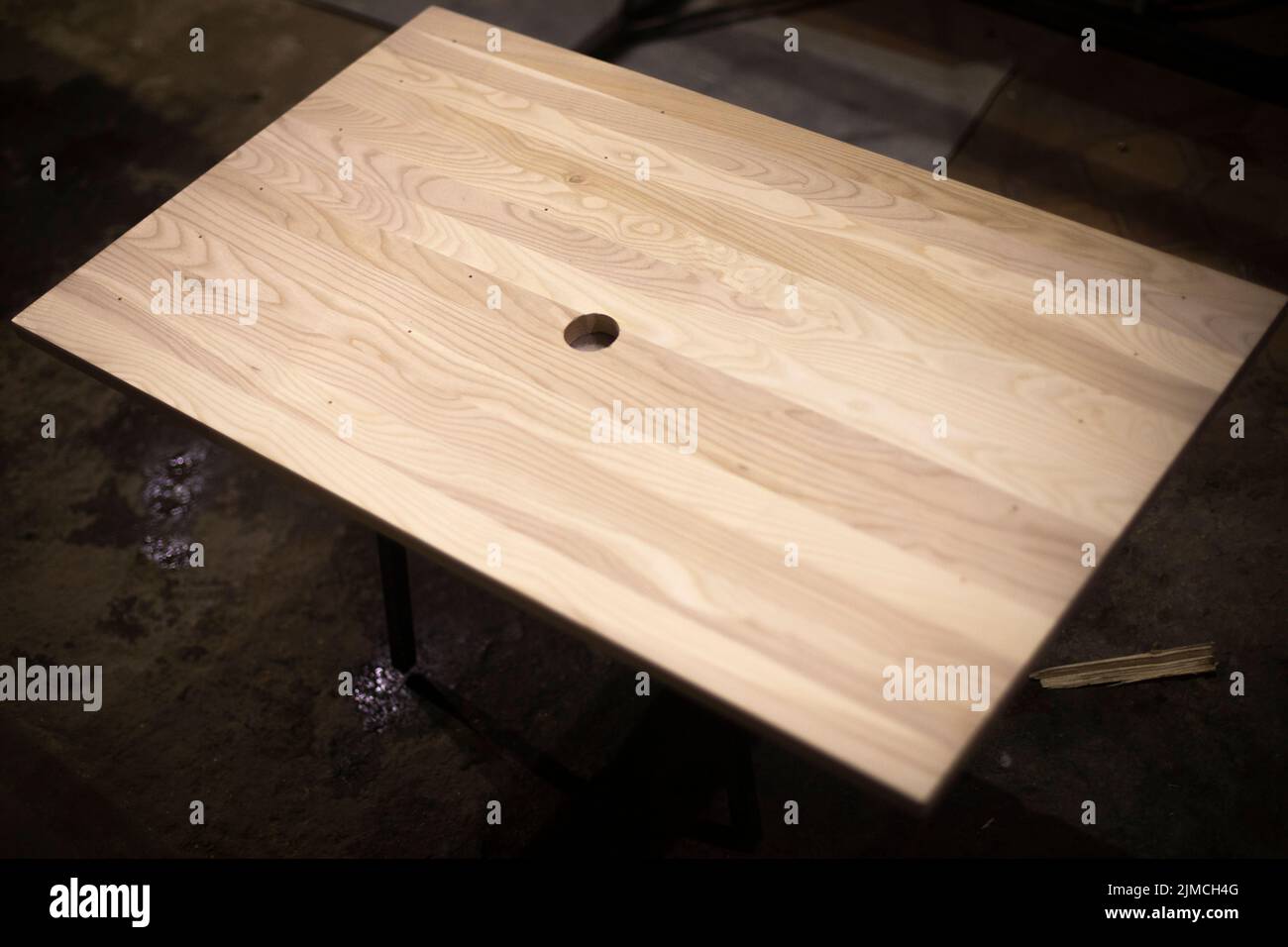 Board in carpentry workshop. Details of furniture manufacturing. Wood ...