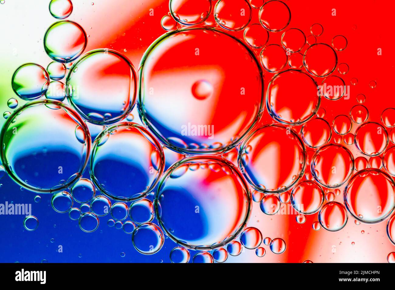 Abstract Background of Oil Bubbles on Water Surface red white blue ...