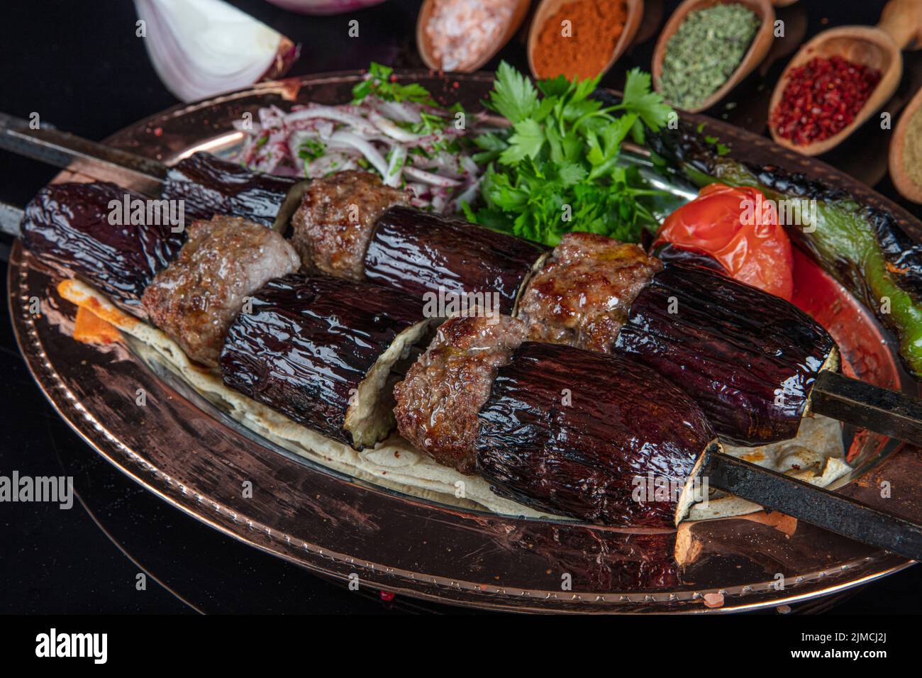 Traditional Turkish kebabs. Eggplant kebab, Adana kebab. With tomatoes ...