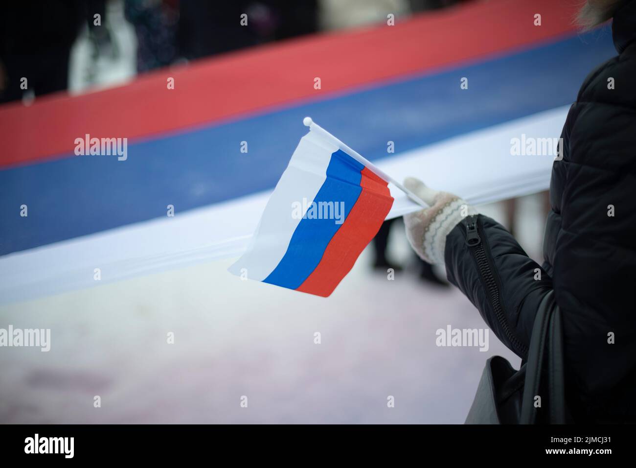Flag of Russia in hand. Symbol of state of Russian Federation. National ...