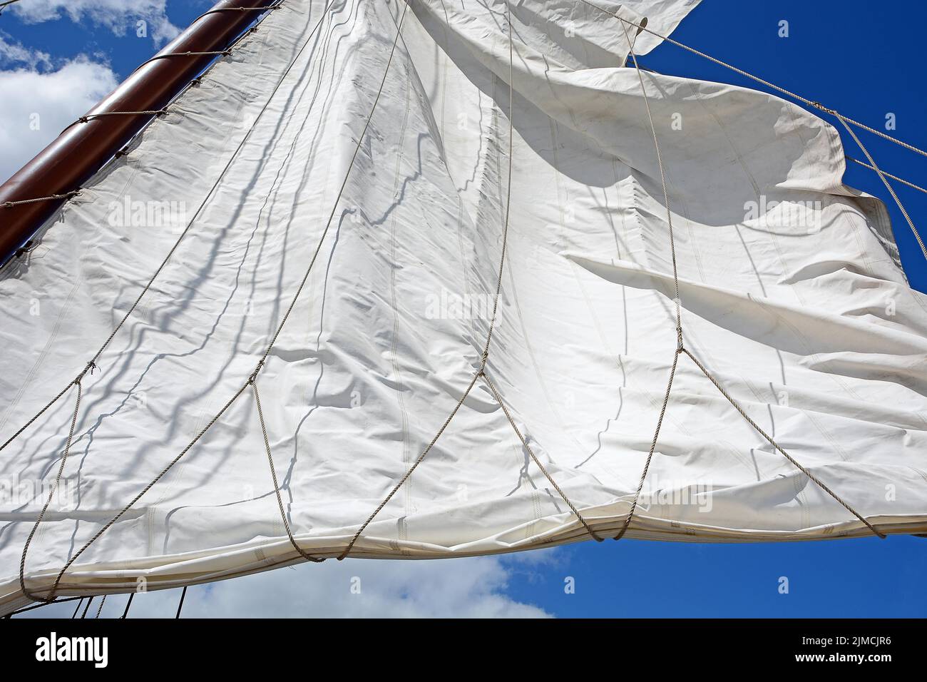 White sail hoisting, Baltic Sea Stock Photo - Alamy