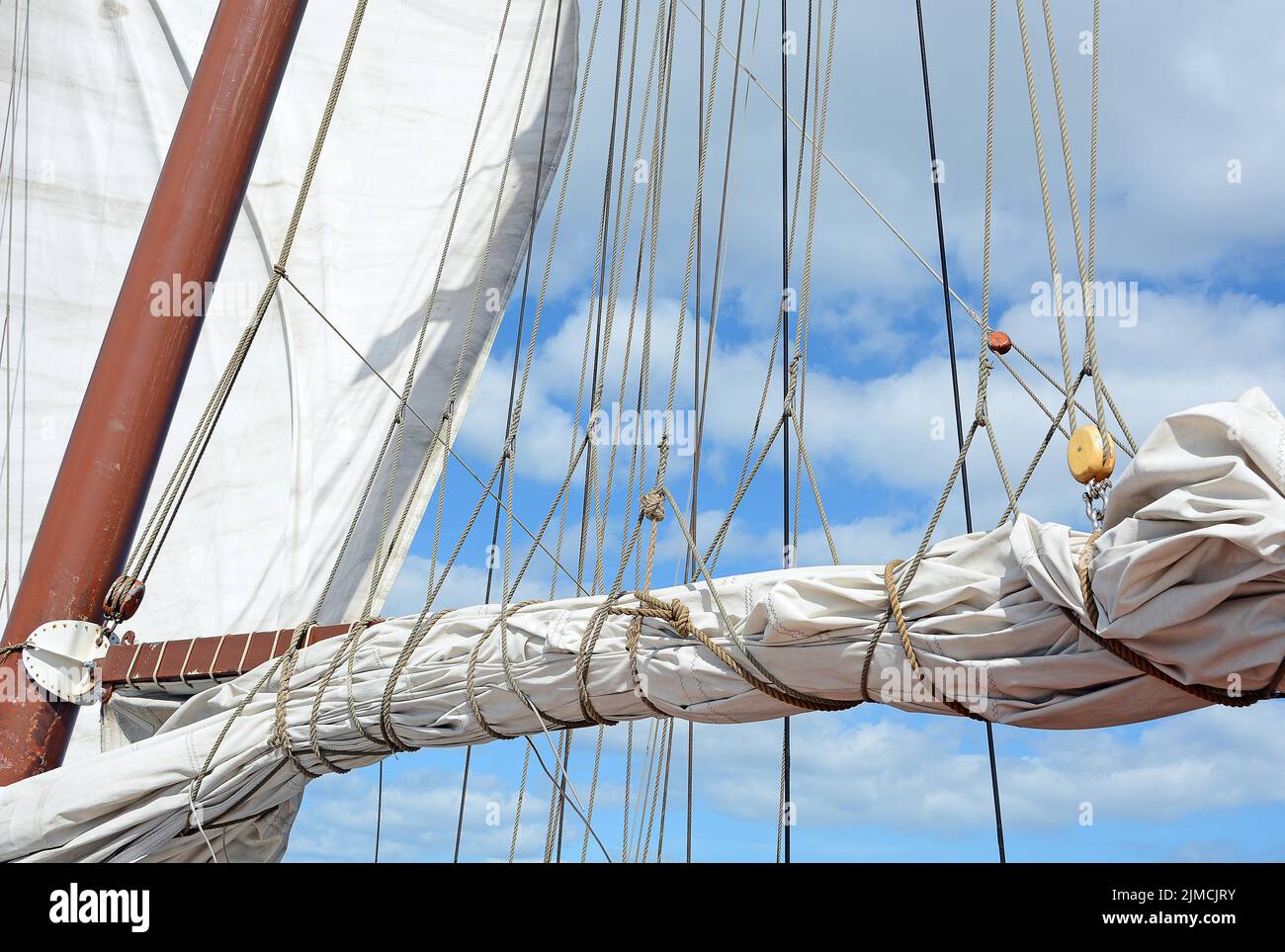 Sails, white, tied together, sailing ship, Baltic Sea Stock Photo - Alamy